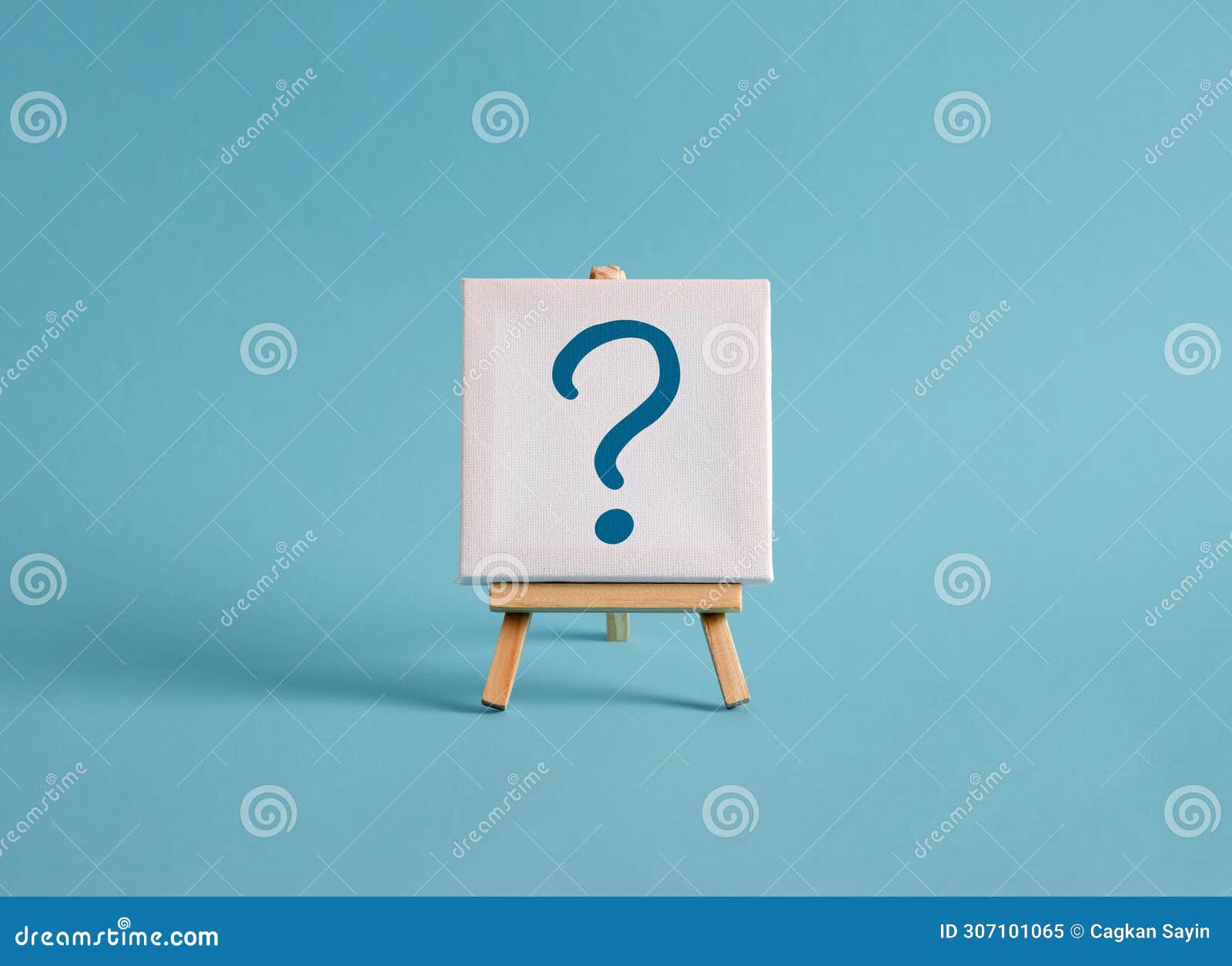 A Canvas With Question Mark Symbol On An Easel With Blue Background ...