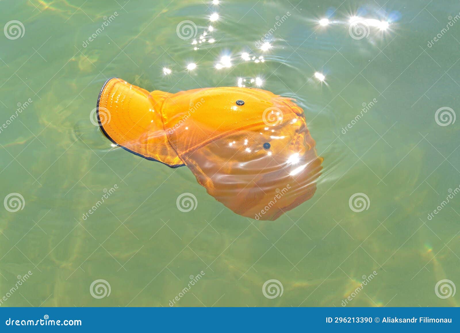 The Cap Floats on the Surface of the Water Stock Photo - Image of male ...