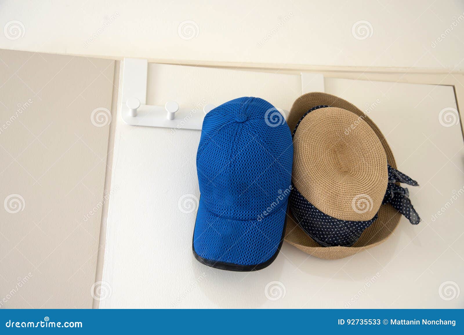 Cap and hat hang on wall stock image. Image of brass - 92735533