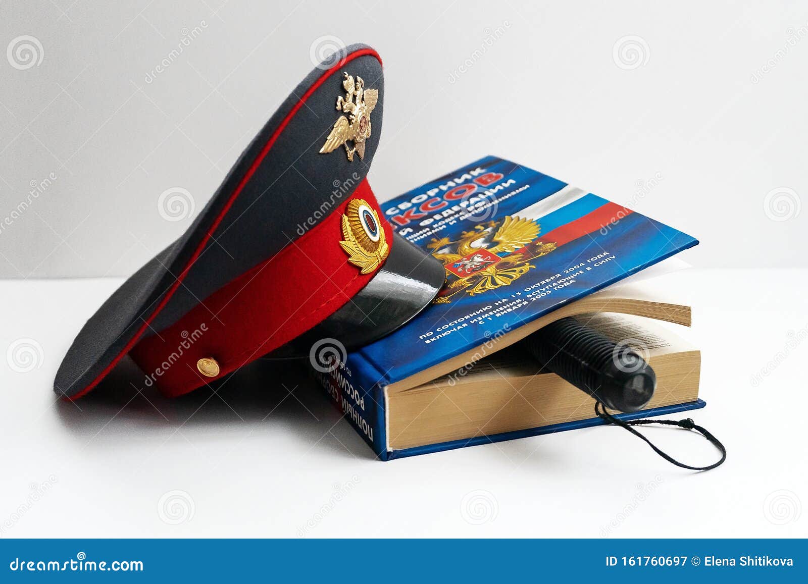 The Cap of a Russian Police Officer and a Rubber Baton is on the Code ...