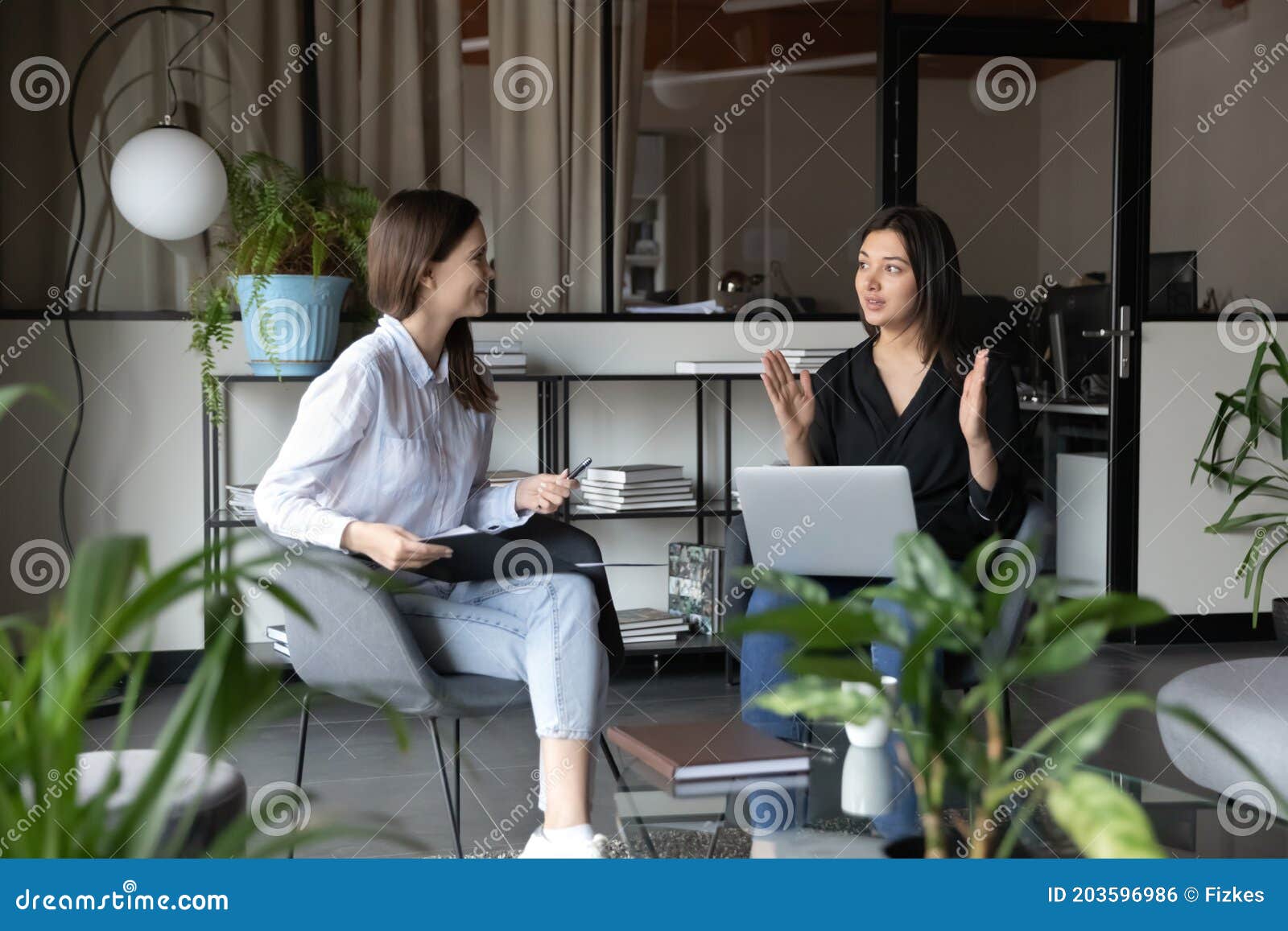 Capable Young Indian Female Mentor Explaining Intern Corporate Work ...