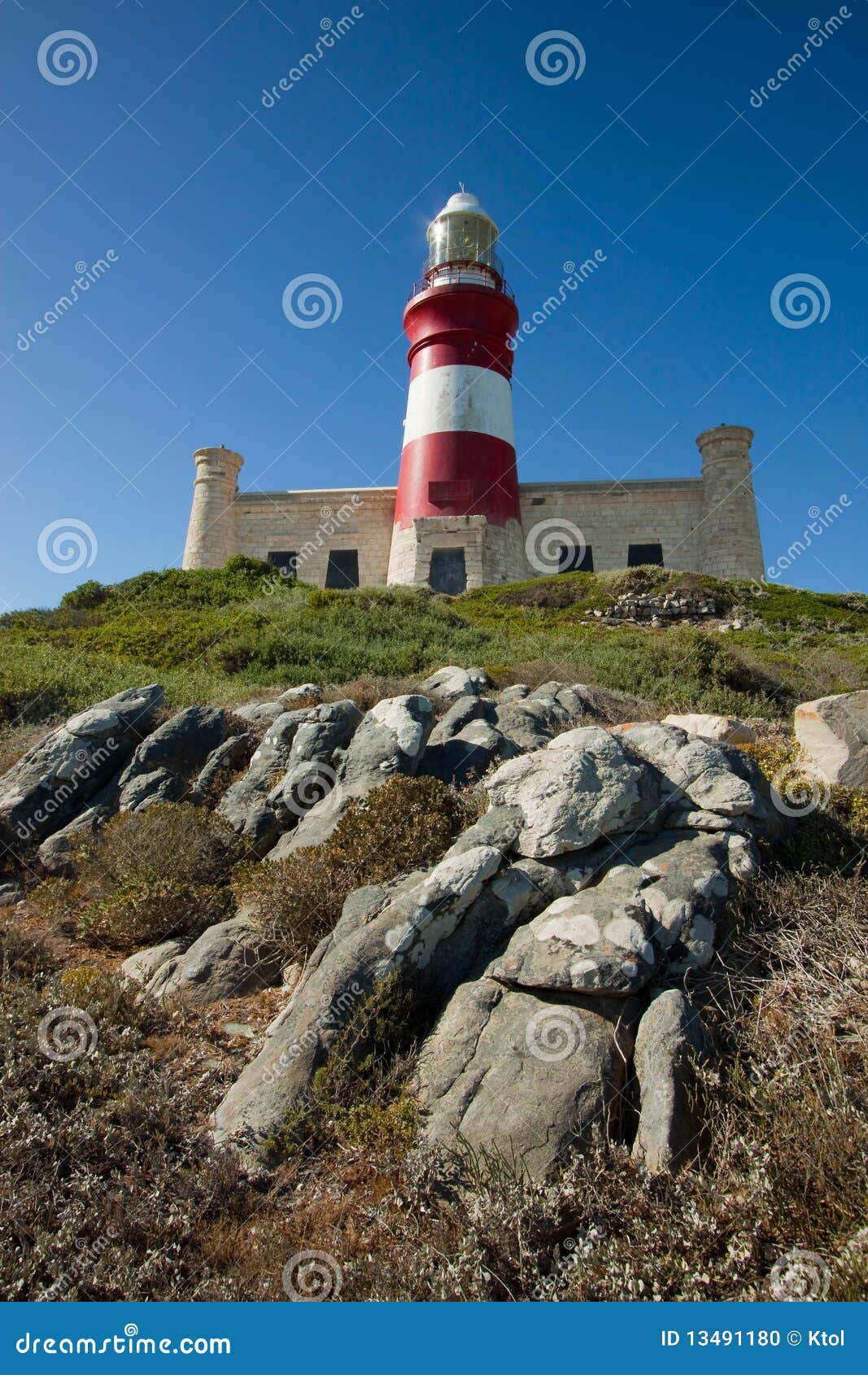 Cape Agulhas Lighthouse stock photo. Image of rocks, bushes - 13491180