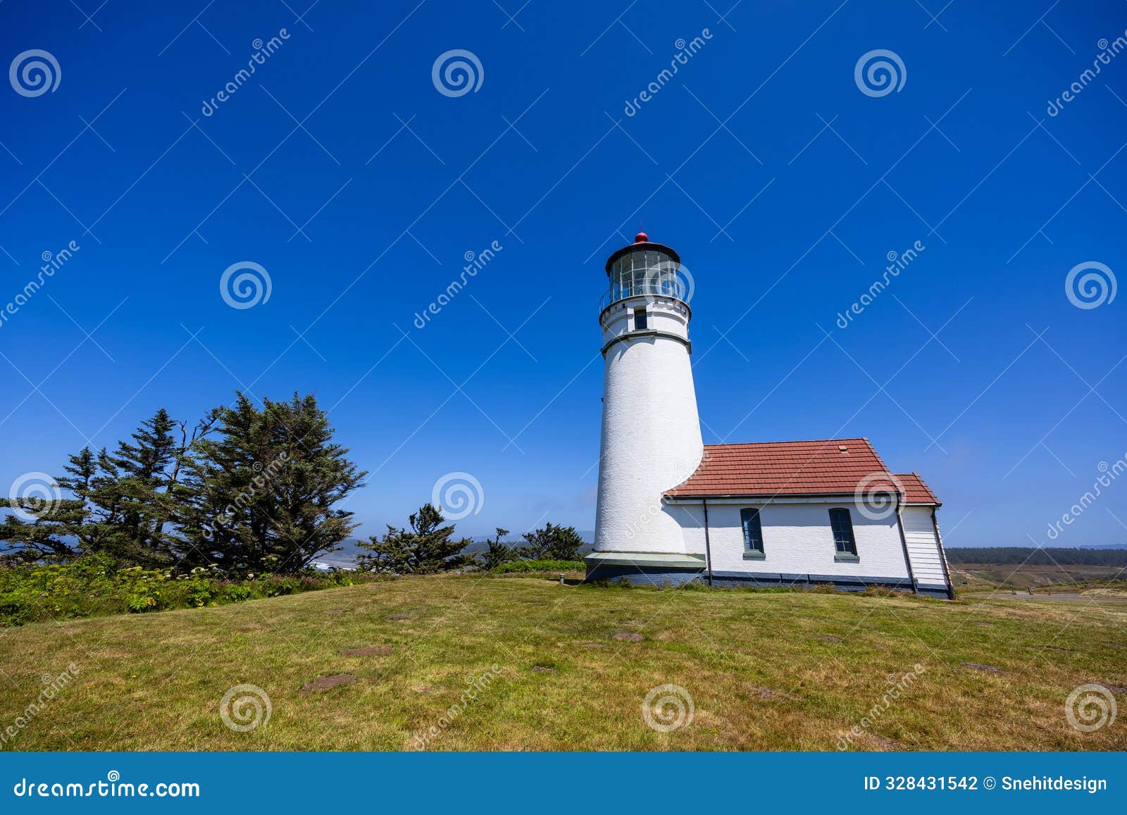 Cape Blanco Lighthouse Against Blue Sky in Oregon State Stock Photo ...