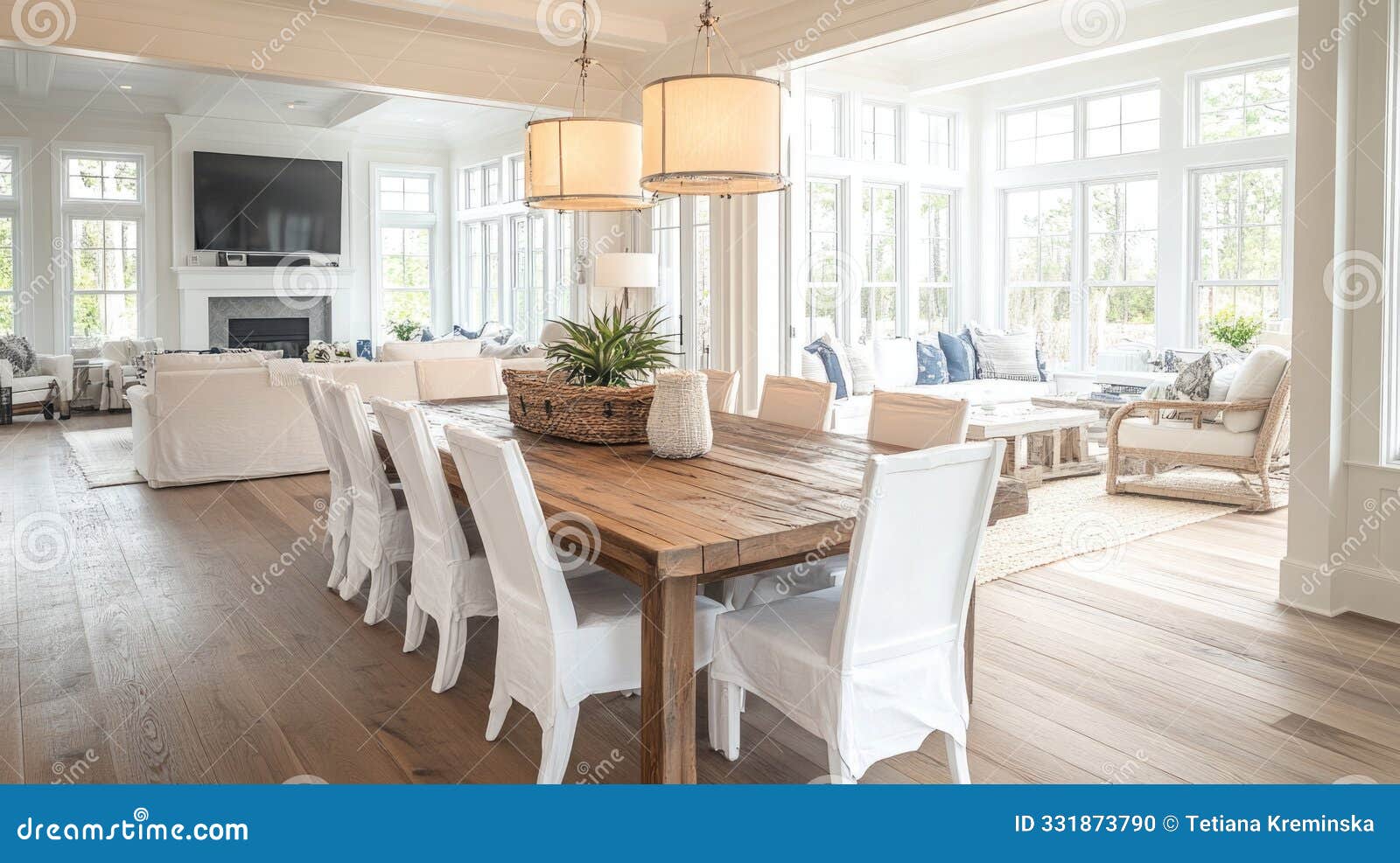 Cape Cod Dining Room with Large Wooden Table, White Chairs, and ...