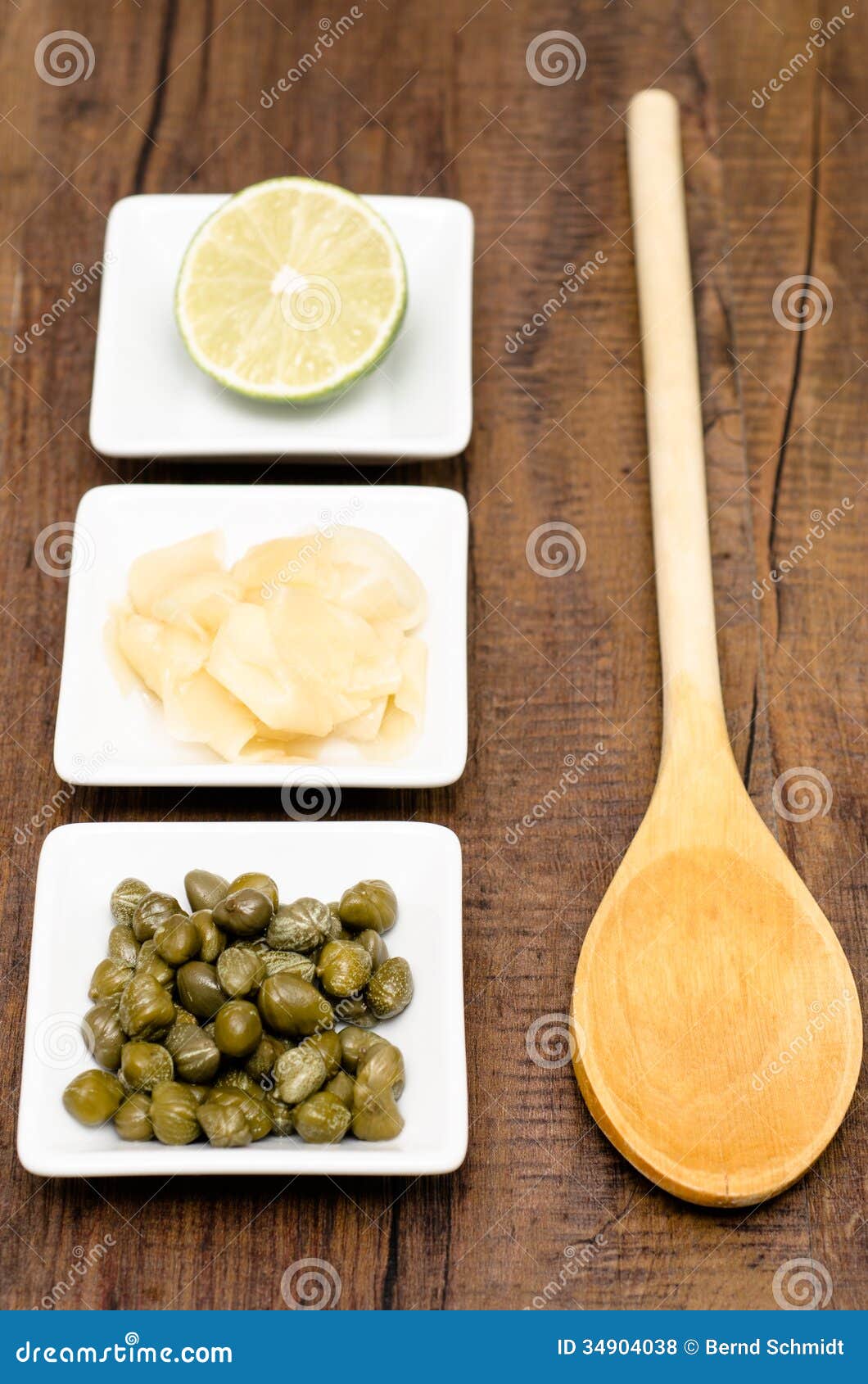 Capers, Ginger and Lime with Wooden Spoon Stock Photo - Image of lime ...
