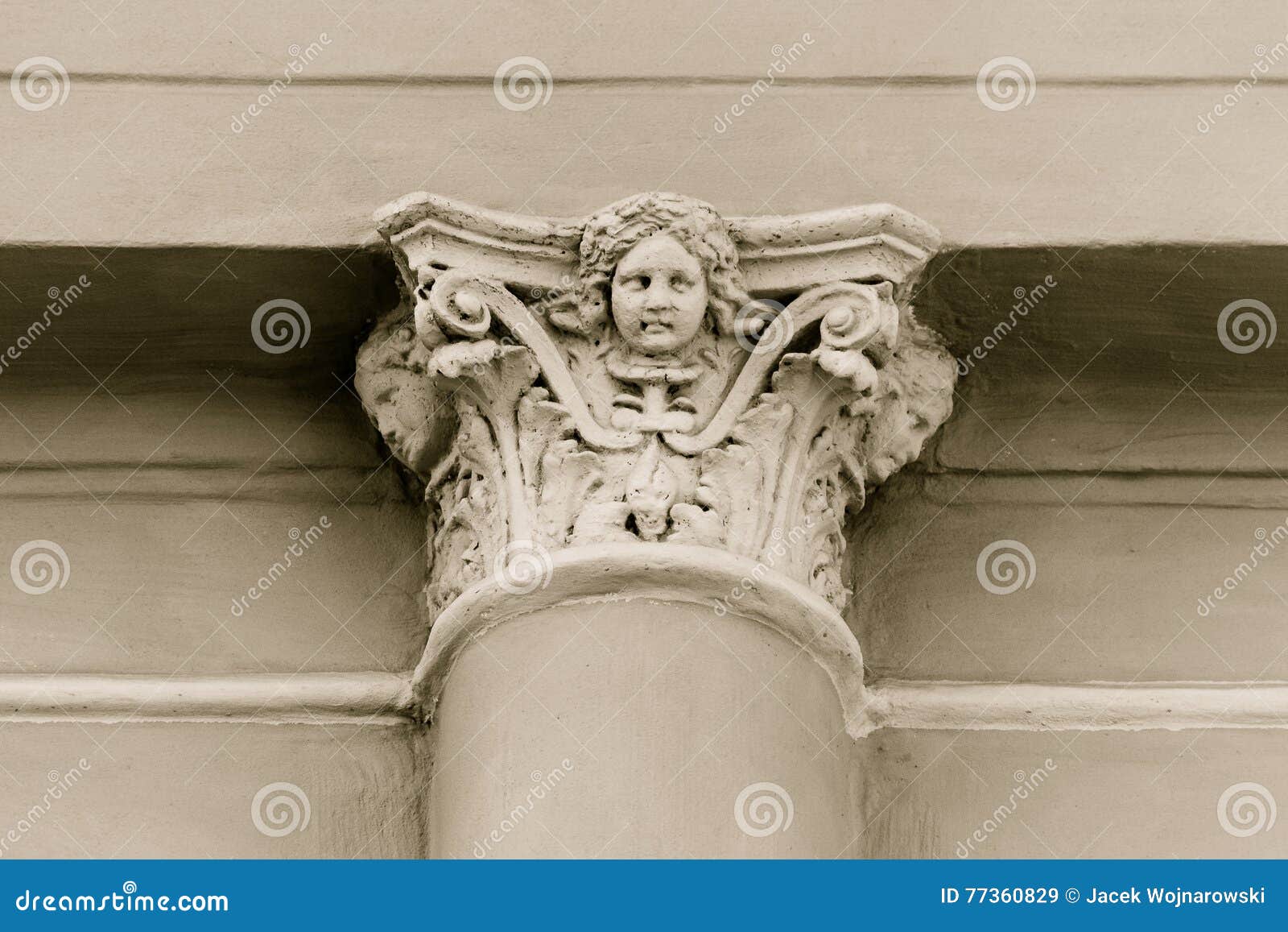 Capital of Corinthian Column with Faces Against Wall Stock Image ...