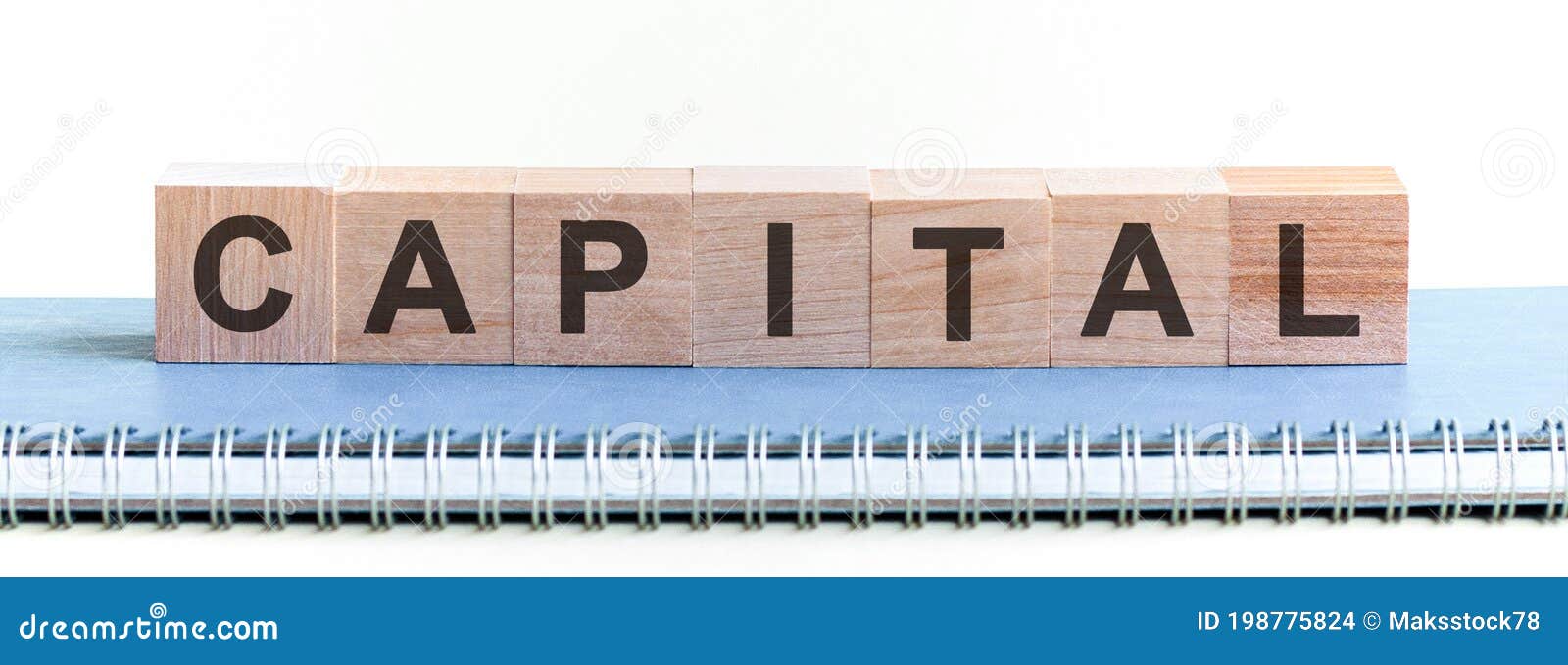 Capital - a Word Made of Wooden Blocks with Black Letters, a Row of ...