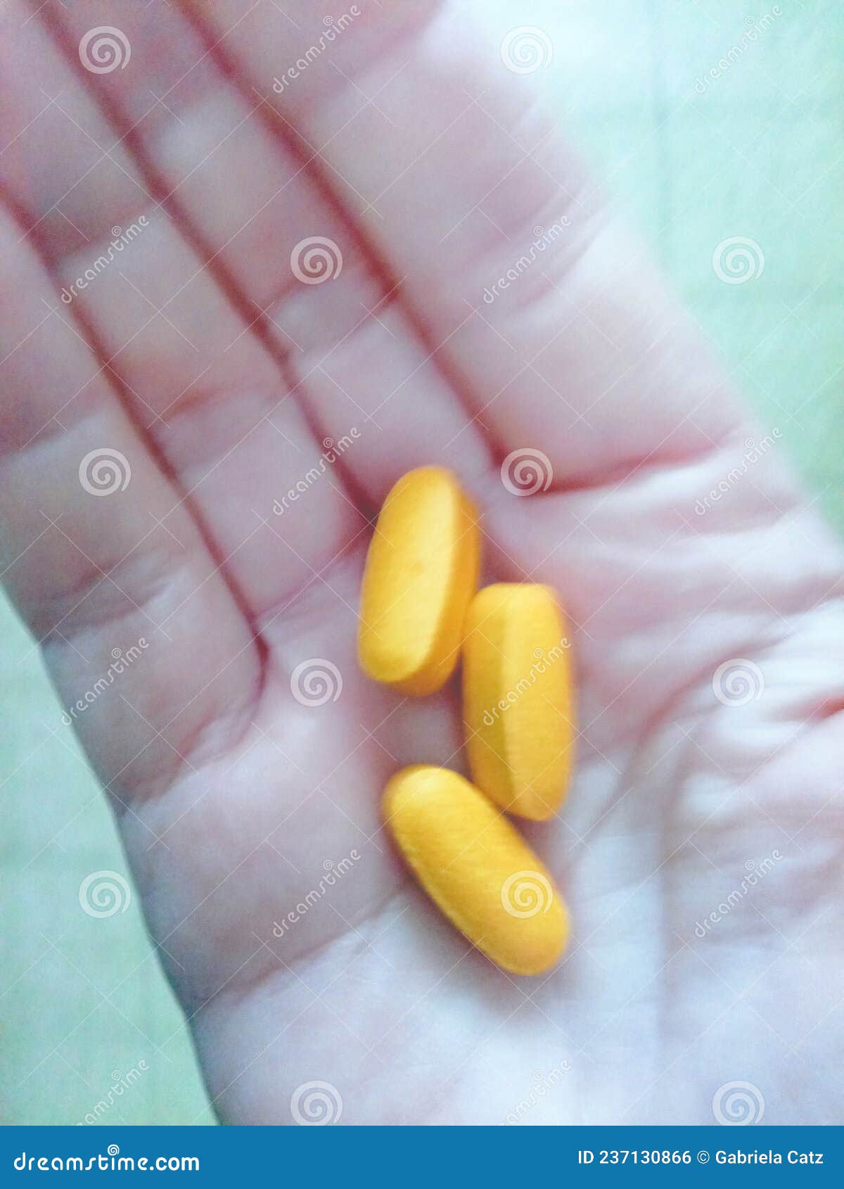 Caplets in hand stock photo. Image of medicine, pharmacy - 237130866