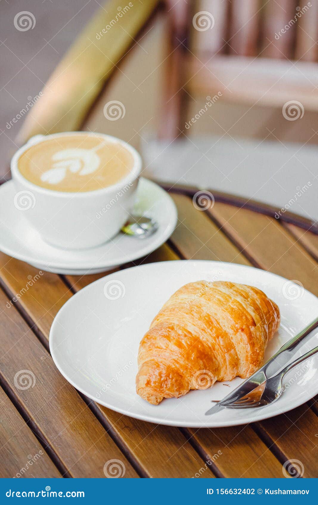 Cappuccino and Croissant stock photo. Image of table - 156632402