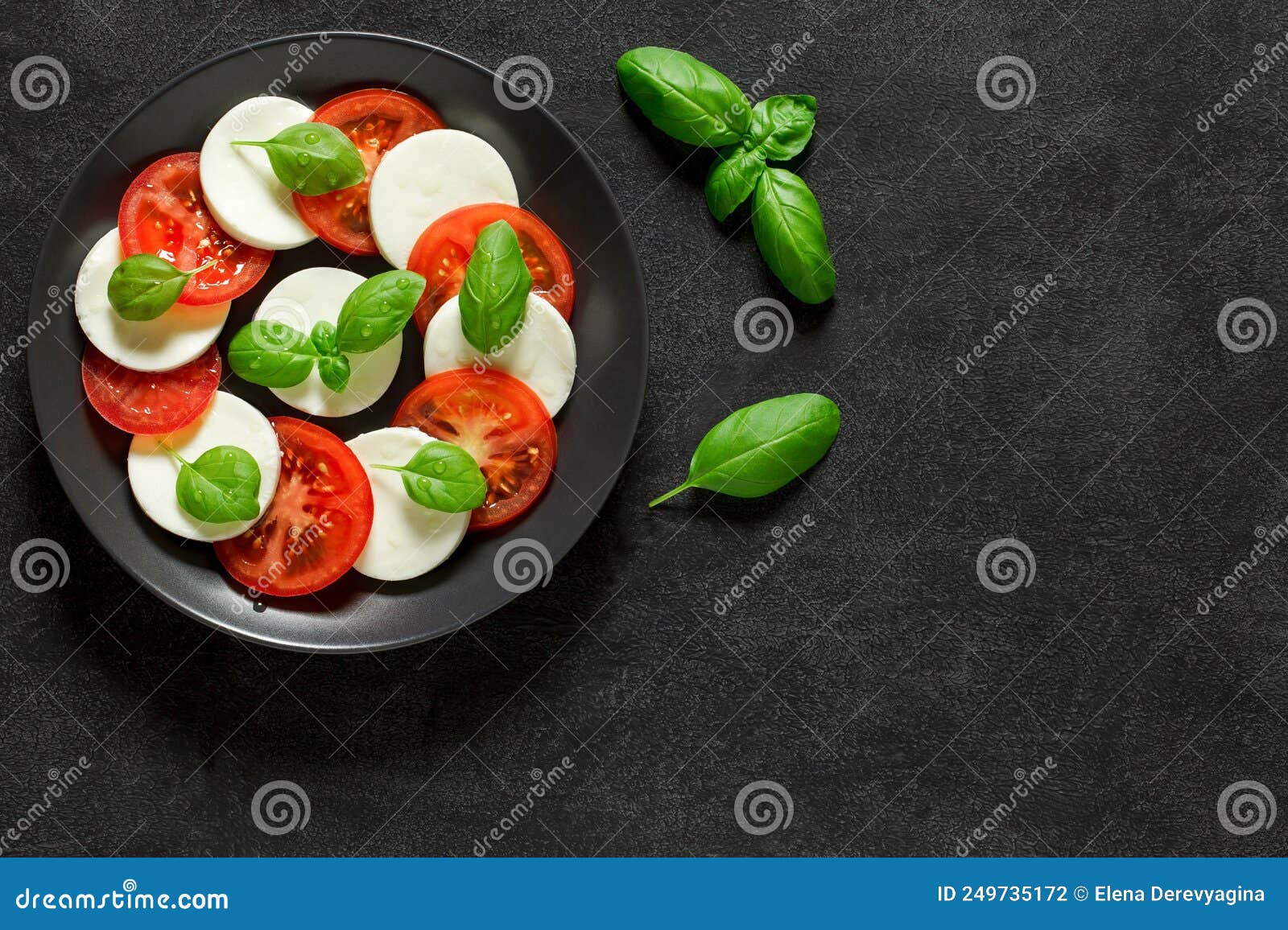 Caprese on Plate and Basil Leaves, on Dark Background, Top View, Space ...