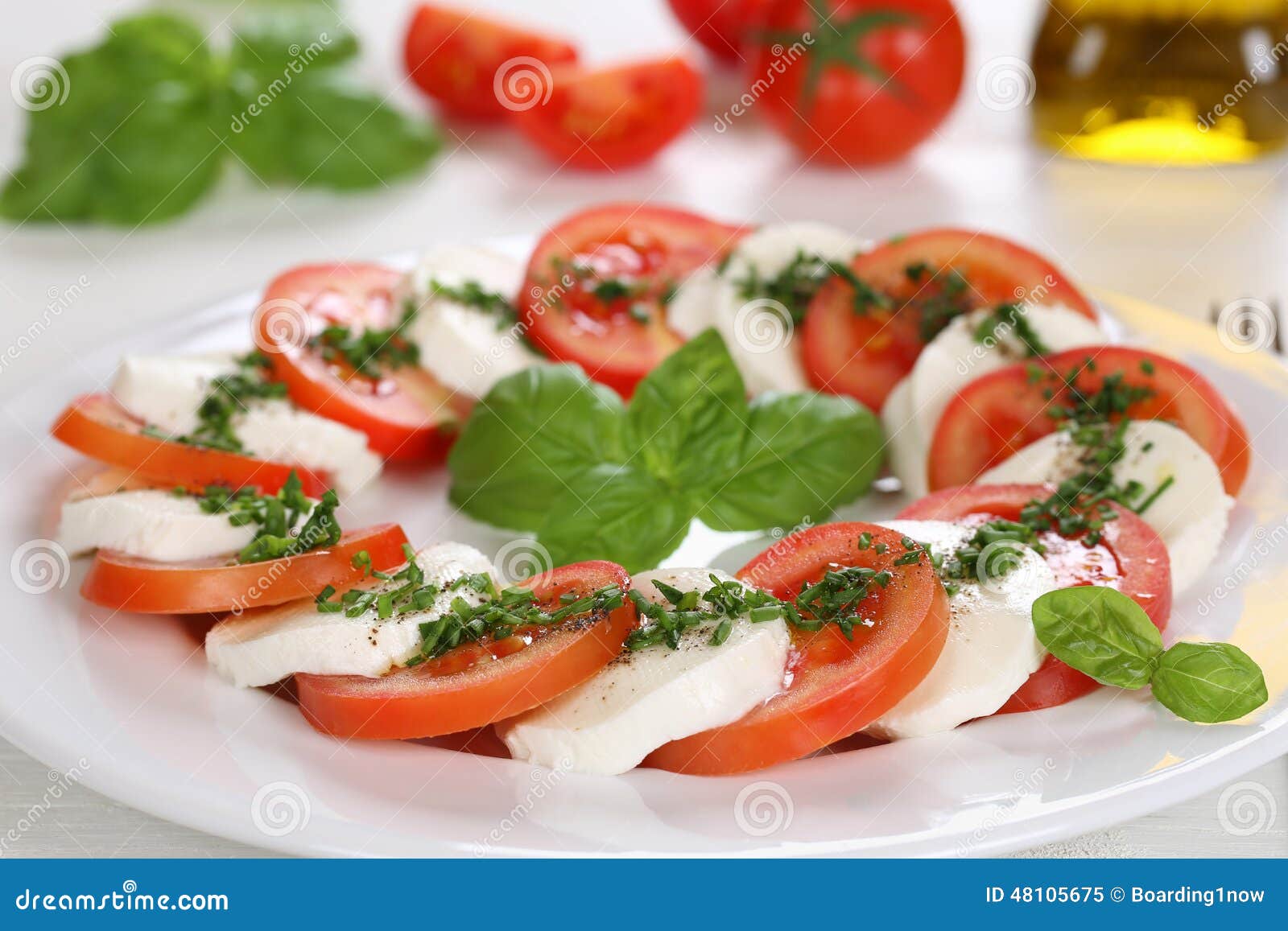 Caprese Salad with Tomatoes and Mozzarella Cheese on Plate Stock Image ...
