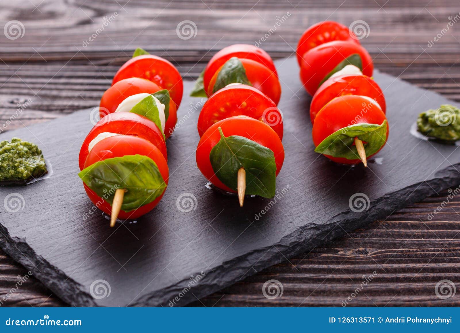 Caprese Salad on a Wooden Rustic Background Stock Image - Image of ...