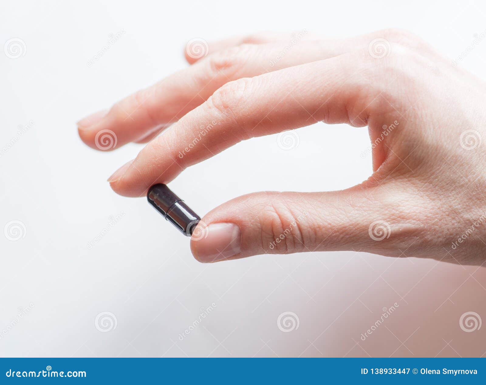 Capsule pill in fingers stock image. Image of fingers - 138933447