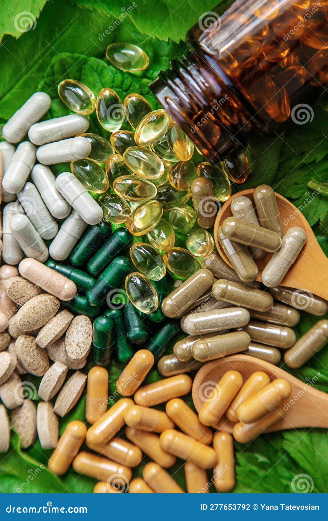 Capsules Herb Supplements on Green Leaves Background. Selective Focus ...