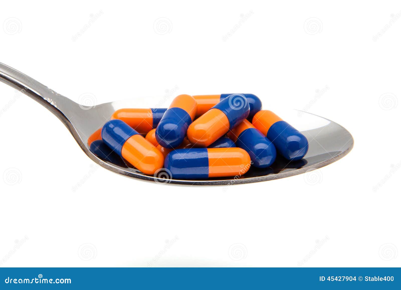 Capsules in a spoon stock photo. Image of prescription - 45427904