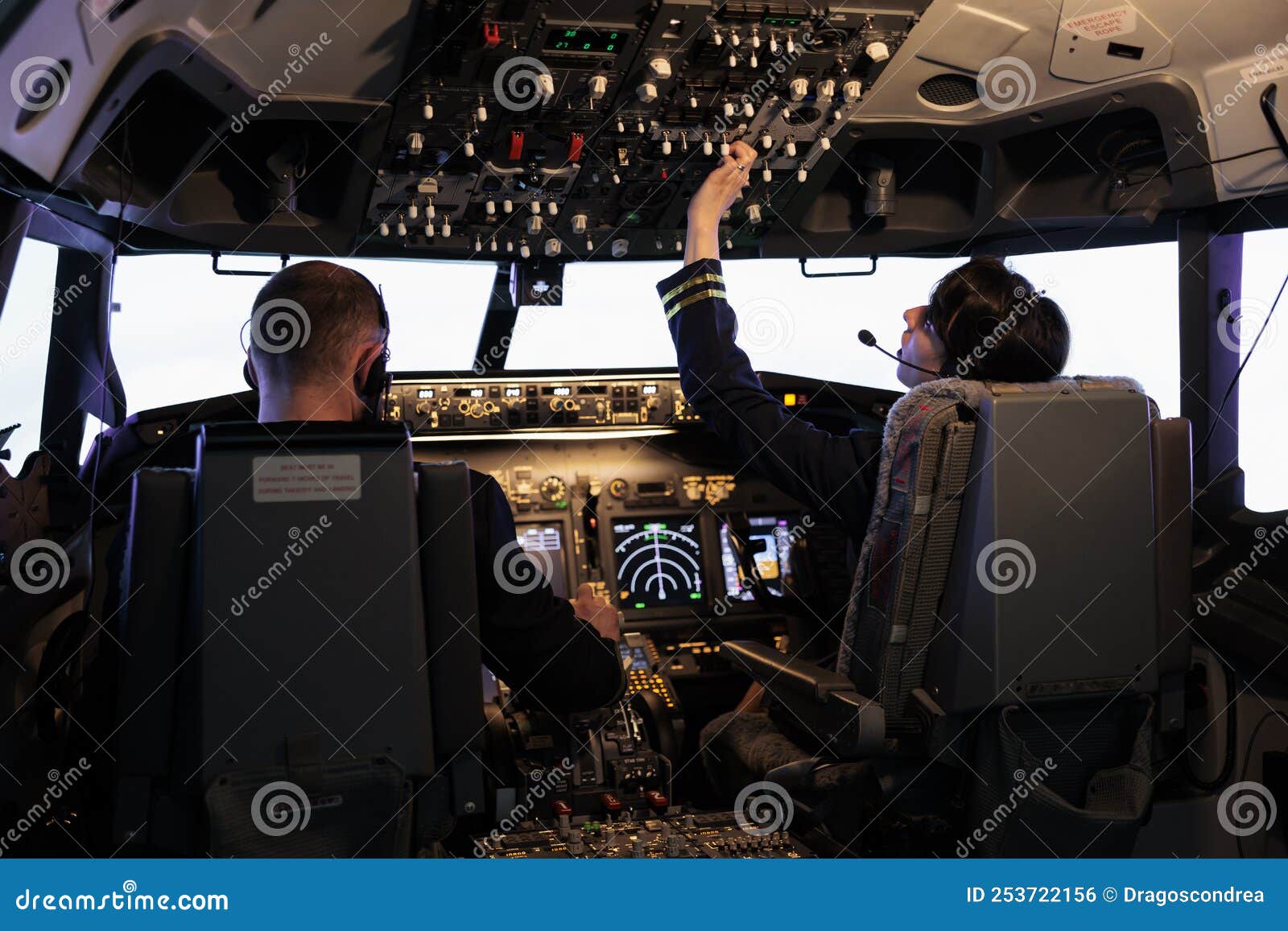 Captain and Female Copilot Getting Ready To Fly Plane Stock Photo ...