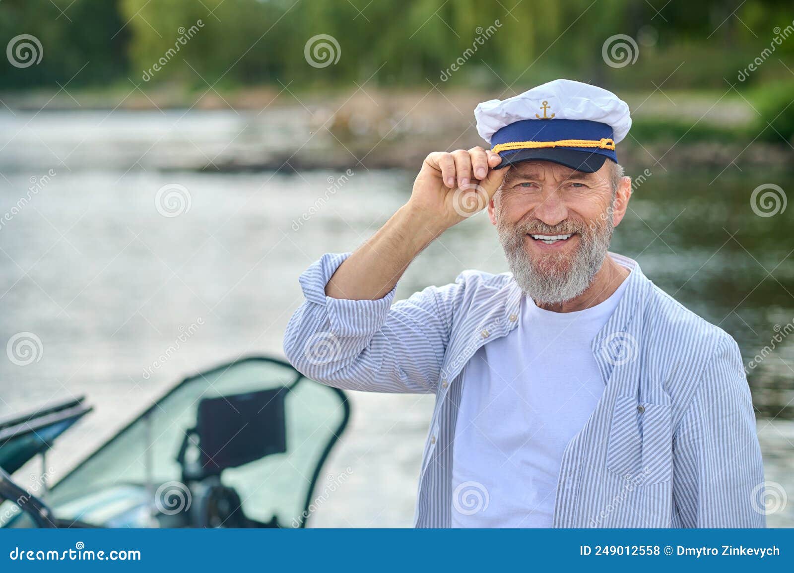Matture Man in Captains Cap Looking Confident Stock Photo - Image of ...