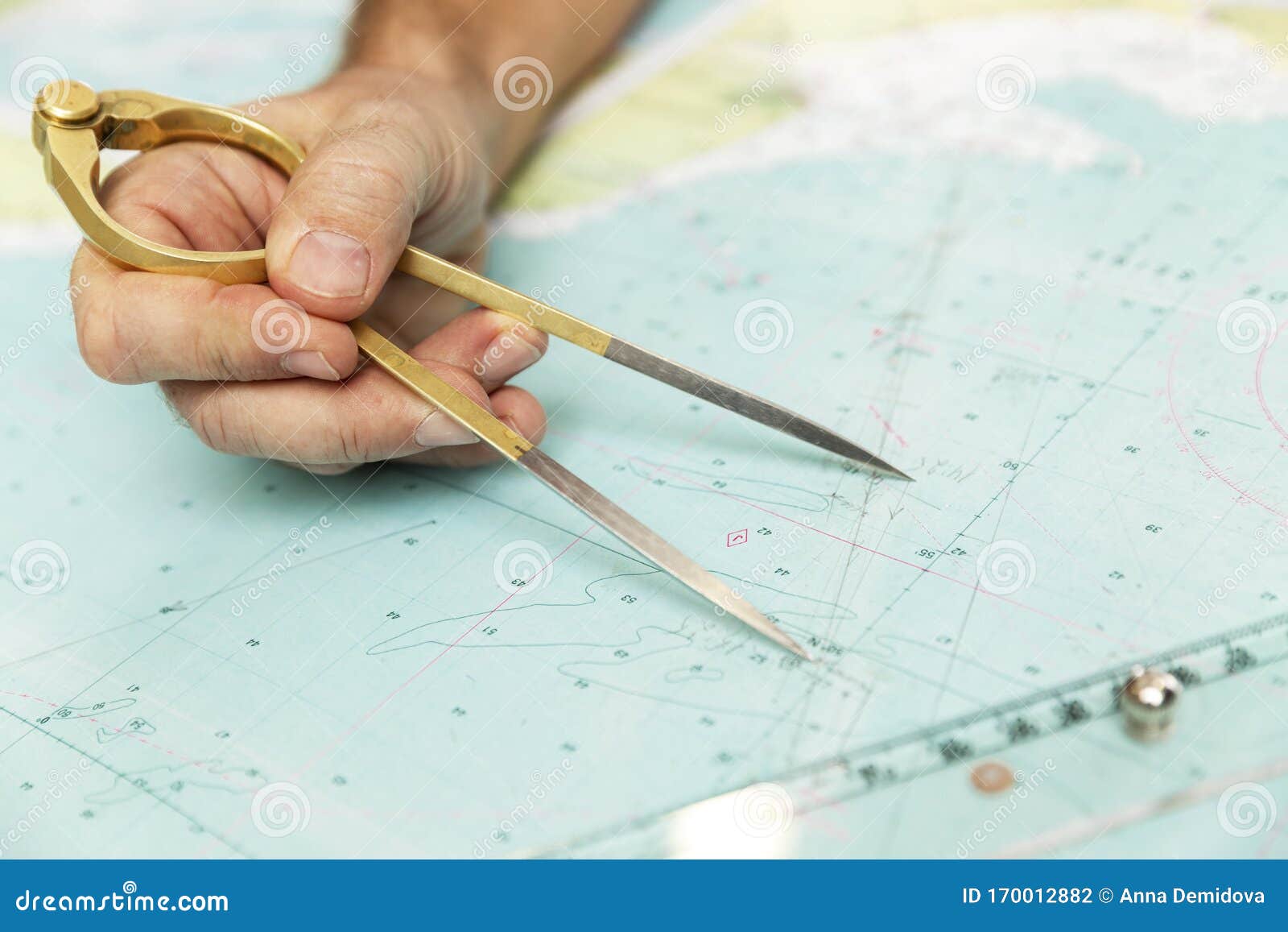 The Captain Measures the Distance on the Map with a Compass. Close-up ...