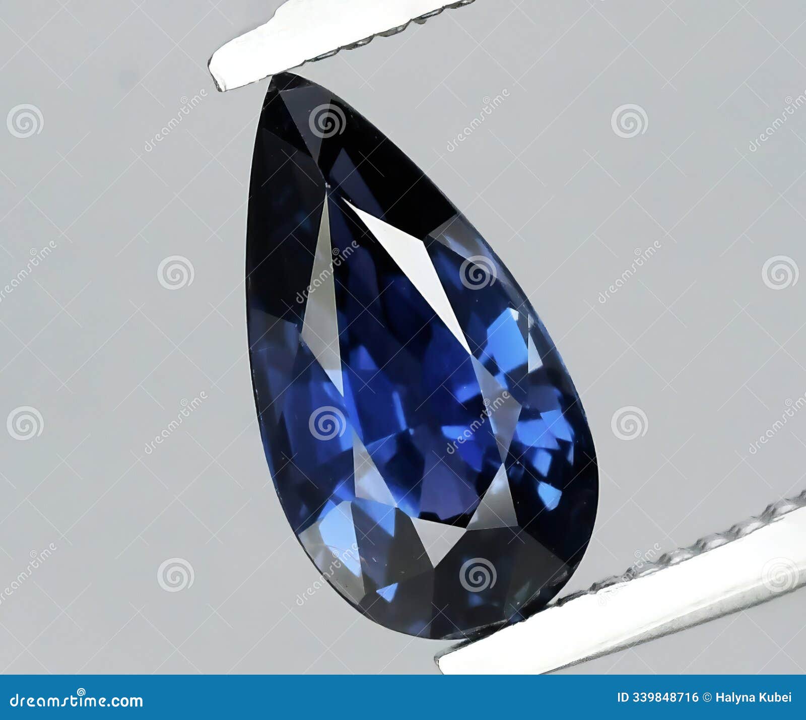 Captivating Deep Blue Teardrop Gemstone Elegantly Cropped for Display ...