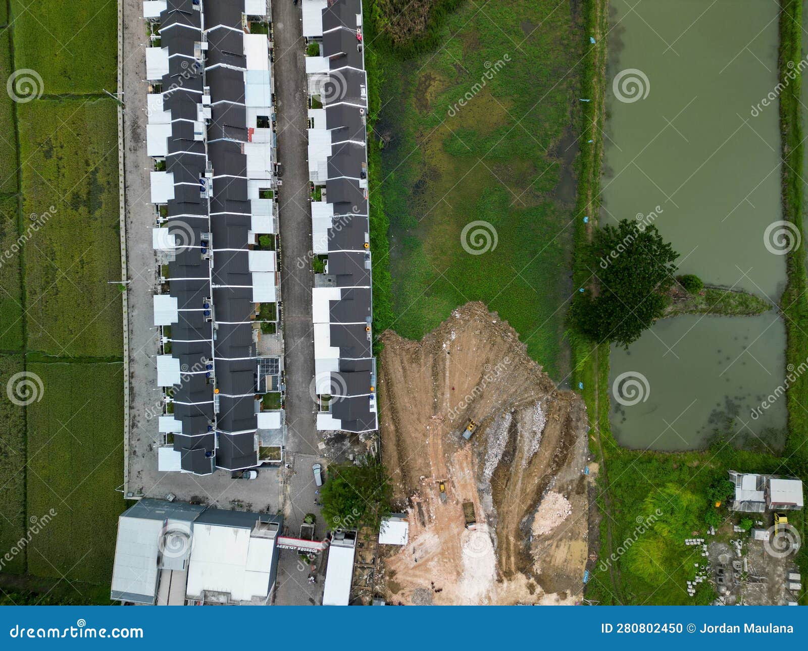 Aerial Perspective of Modern Housing Construction Soaring Above Lush ...