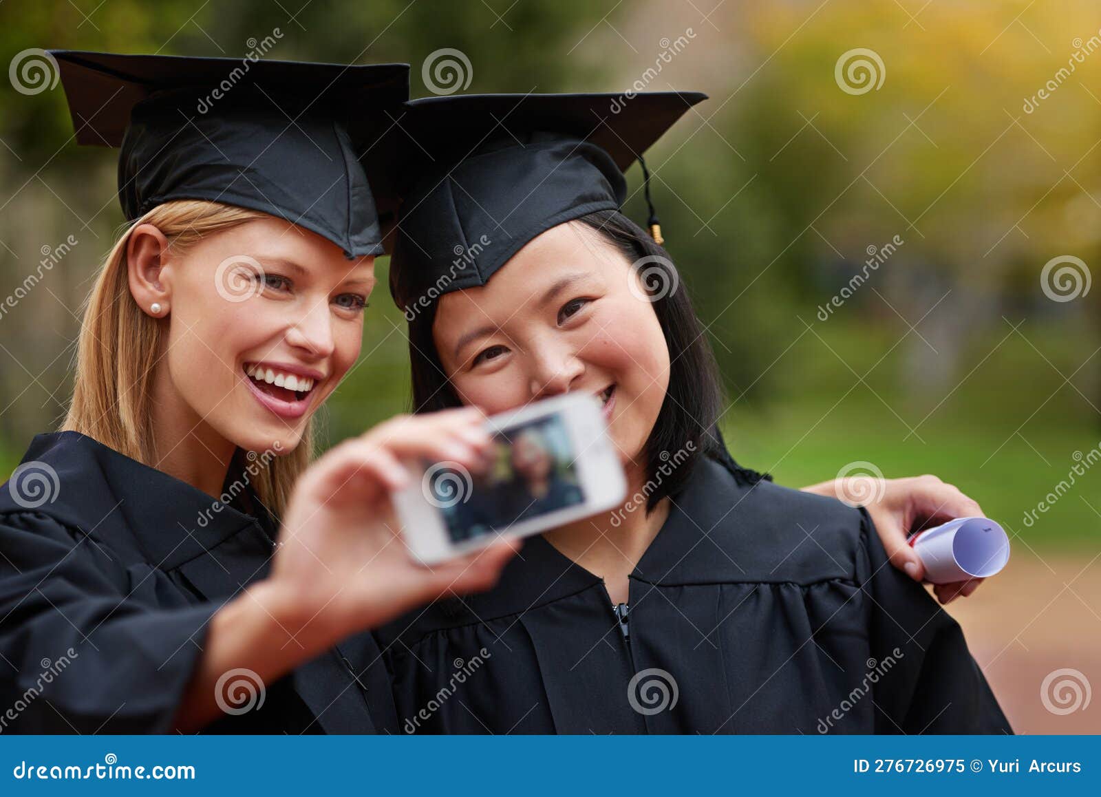 Capturing the Start To New Beginnings. Two College Graduates Taking a ...