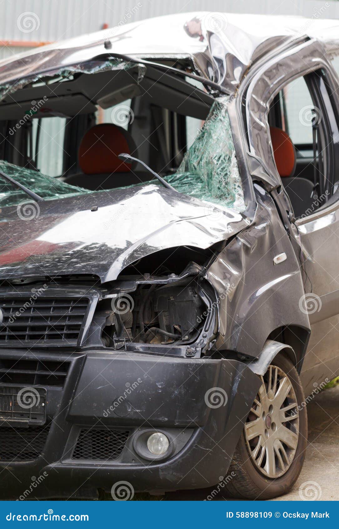 A Black Smashed Passenger Car In The Courtyard Of A Residential ...