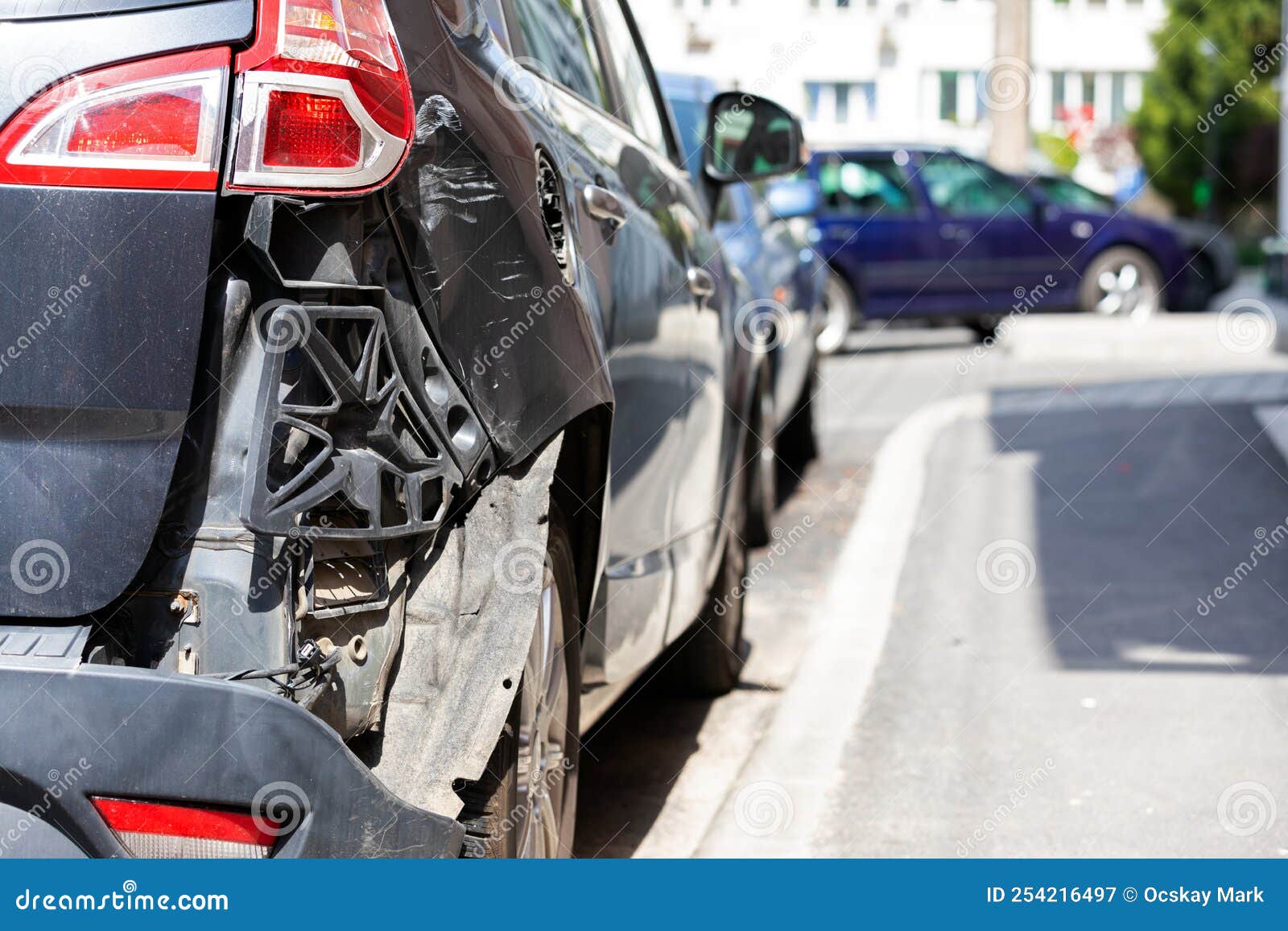 A Black Smashed Passenger Car In The Courtyard Of A Residential ...