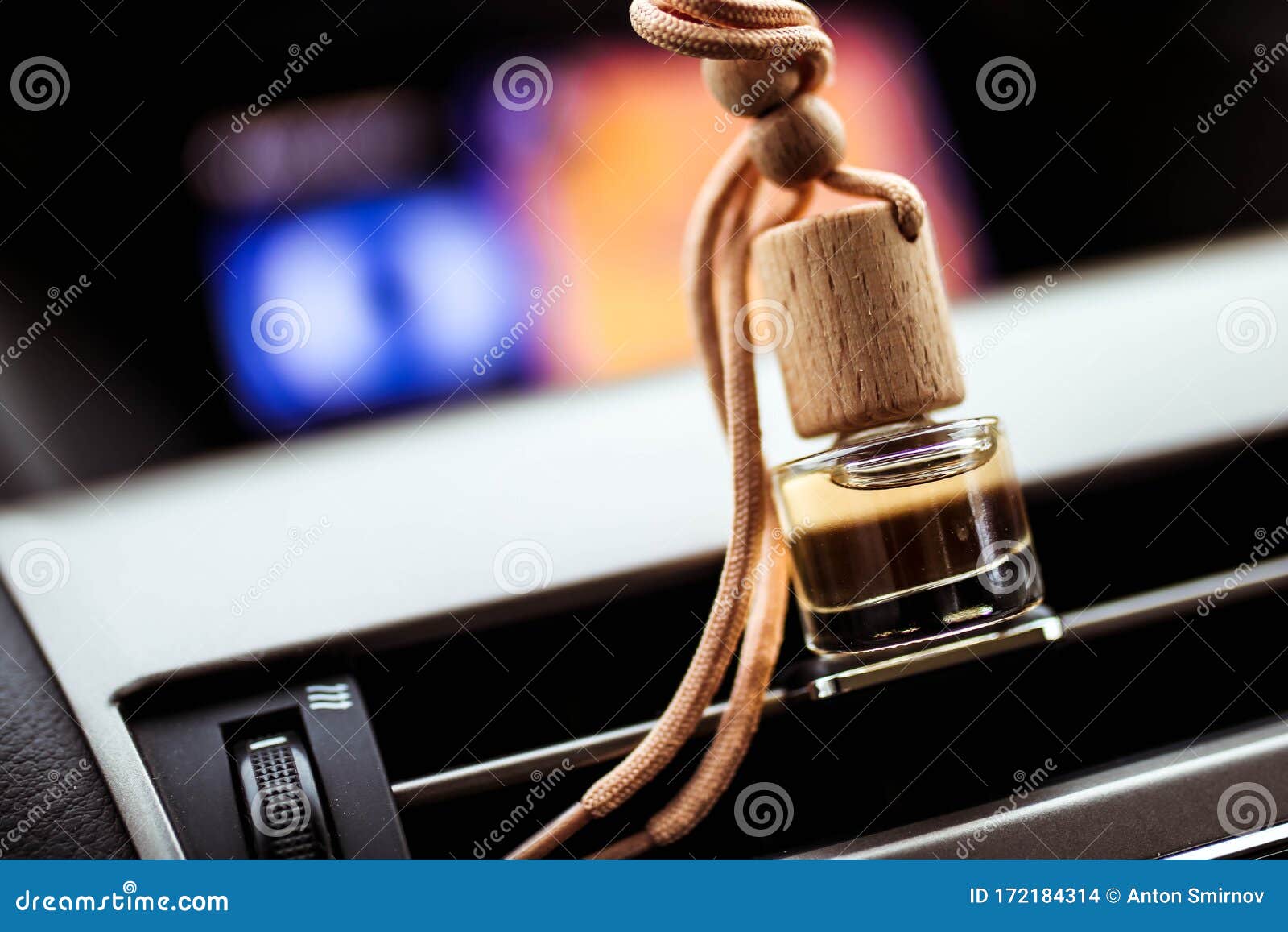 Car Air Perfume Freshener Bottle Inside the Car on Car Panel. Aromatic ...