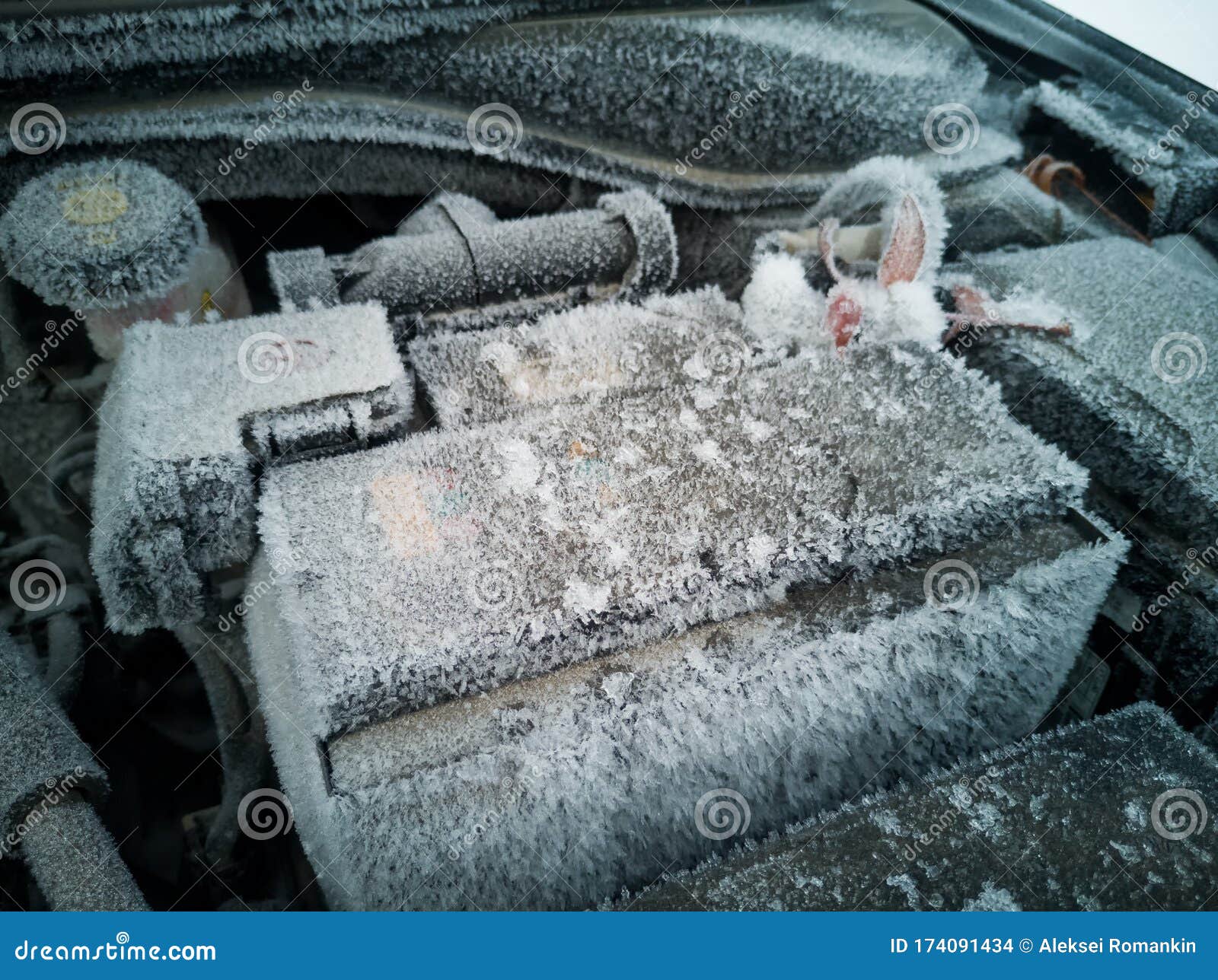 Car Battery Covered in Snow and Ice. Large Pieces of Ice Covered the ...