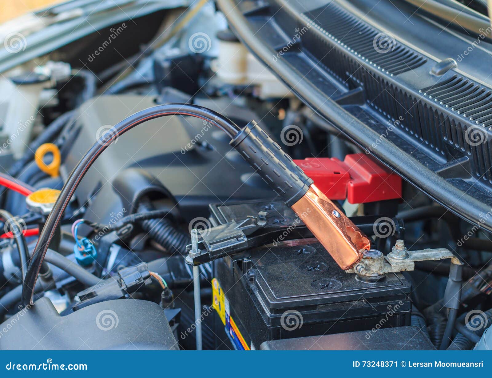 The Car Battery with Jumper Cable in Engine Room Stock Image - Image of ...