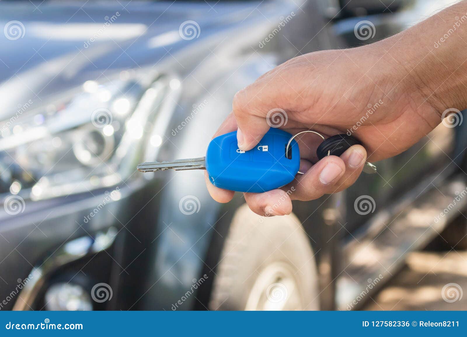 Car blue keys in hand stock photo. Image of blue, vehicle - 127582336