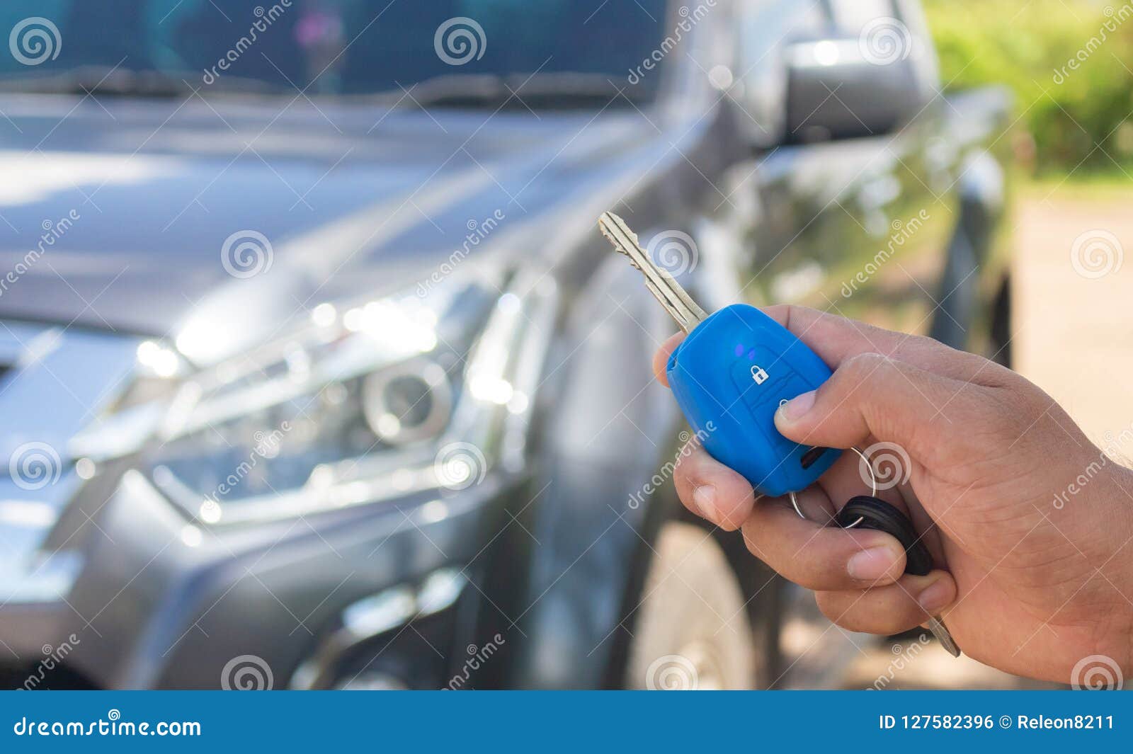 Car blue keys in hand stock photo. Image of vehicle - 127582396
