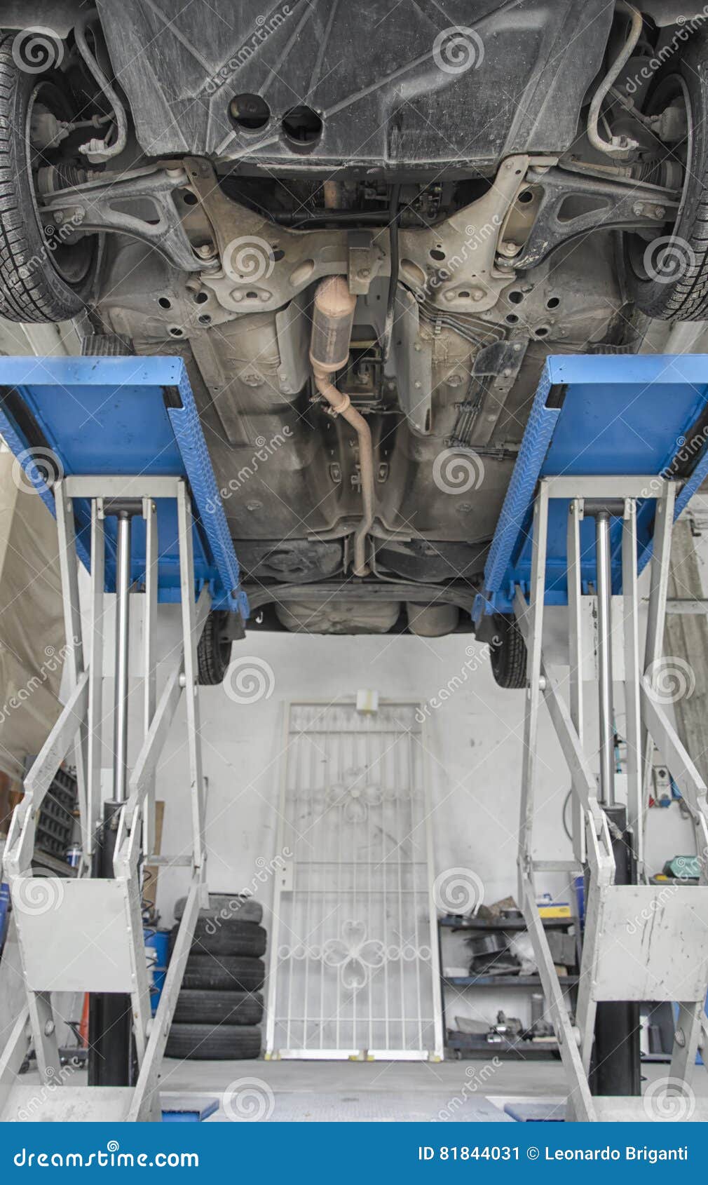 Car bottom in a garage stock image. Image of lift, chassis - 81844031