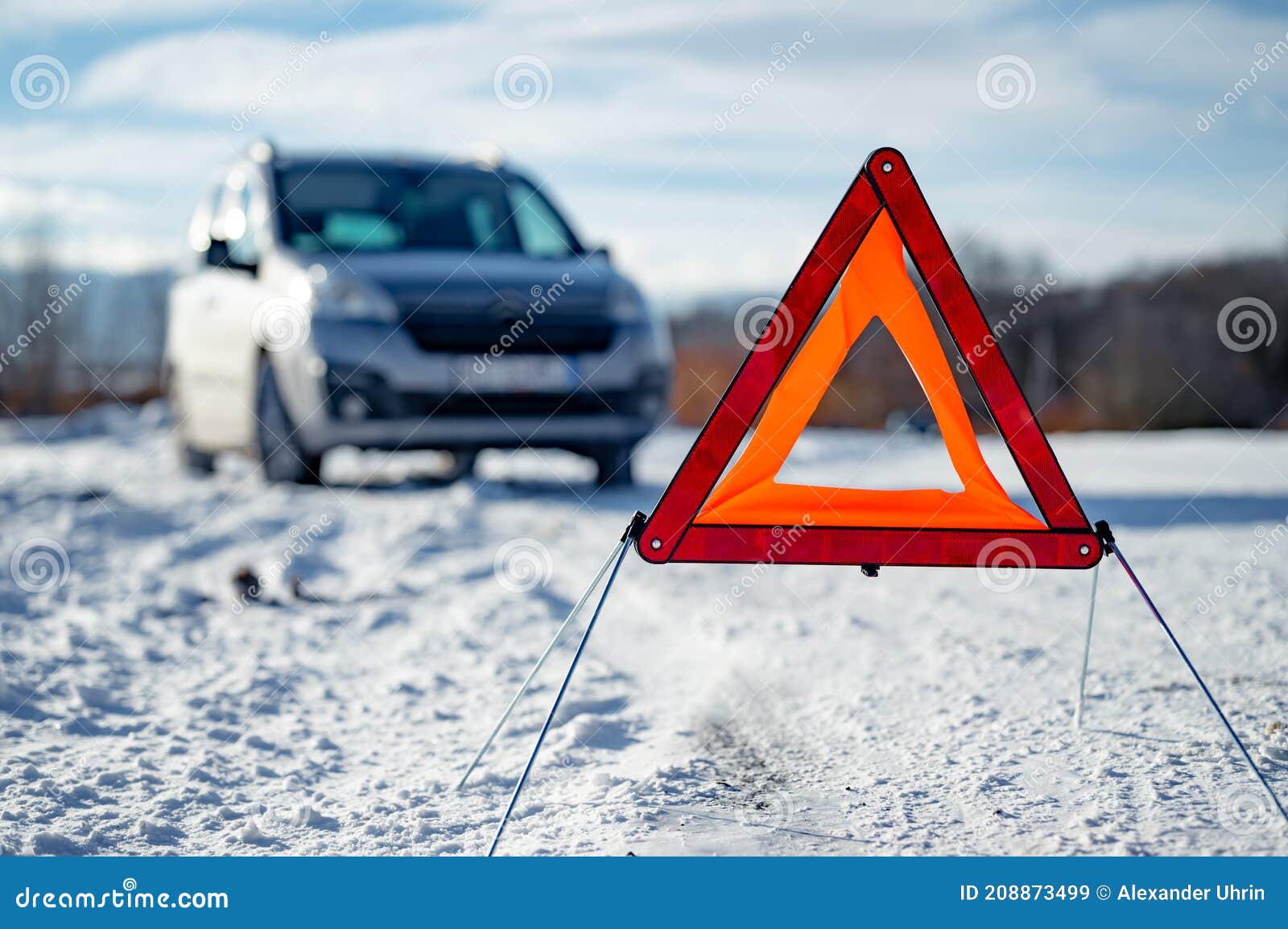 Car Breakdown on a Road in Winter. Winter Driving. Warning Triangle on ...