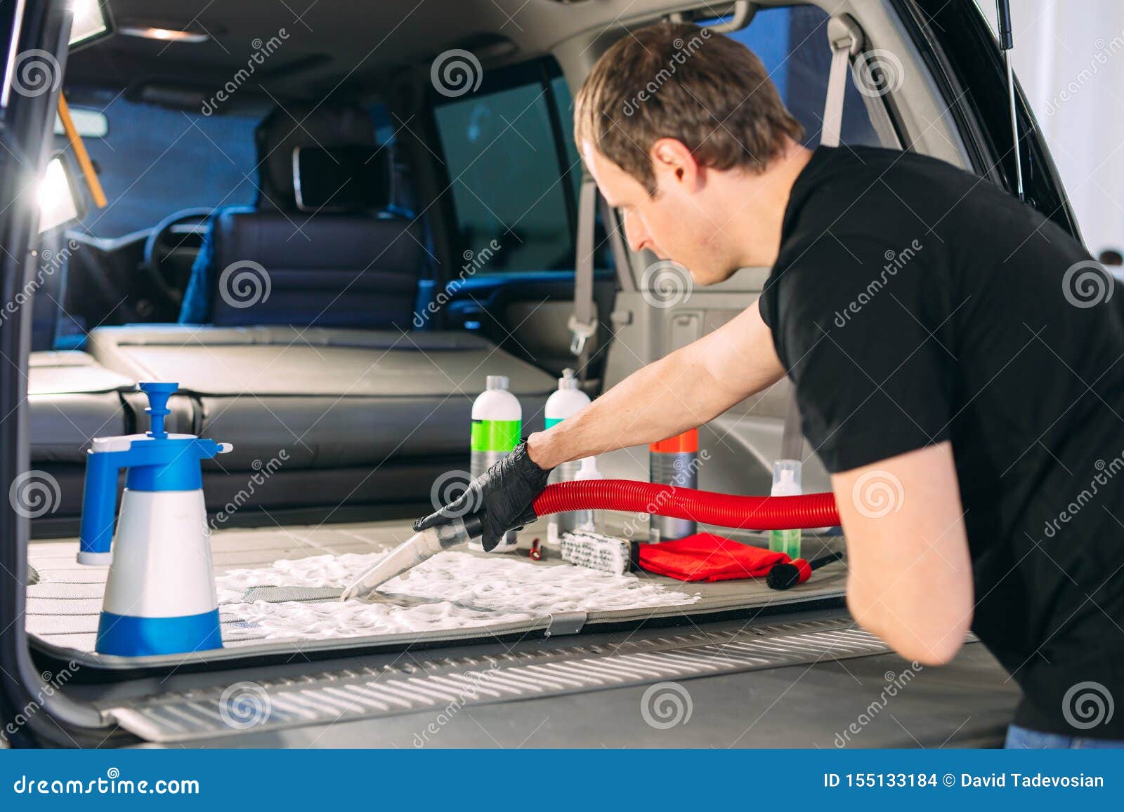 Car Chemist. Chemical Treatment of the Car Trunk. Stock Photo - Image ...
