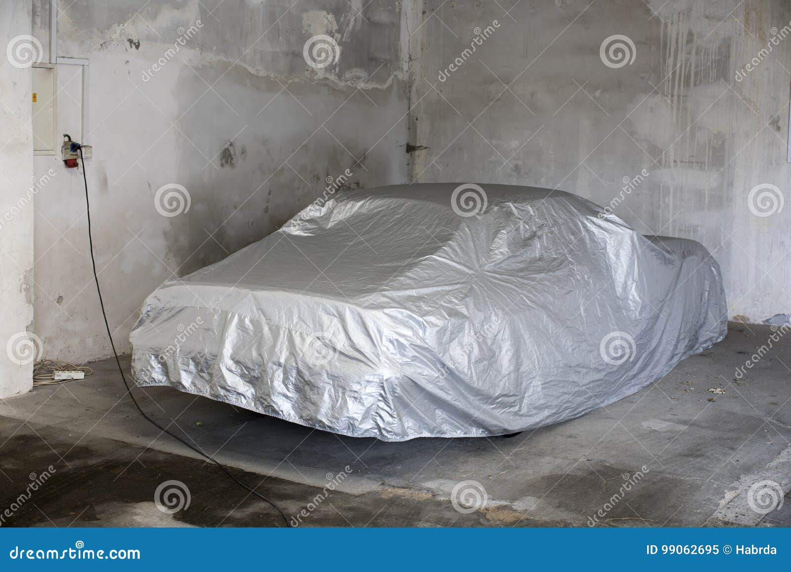 Car Covered Under Silver Sheet Stock Image - Image of garage, silver ...