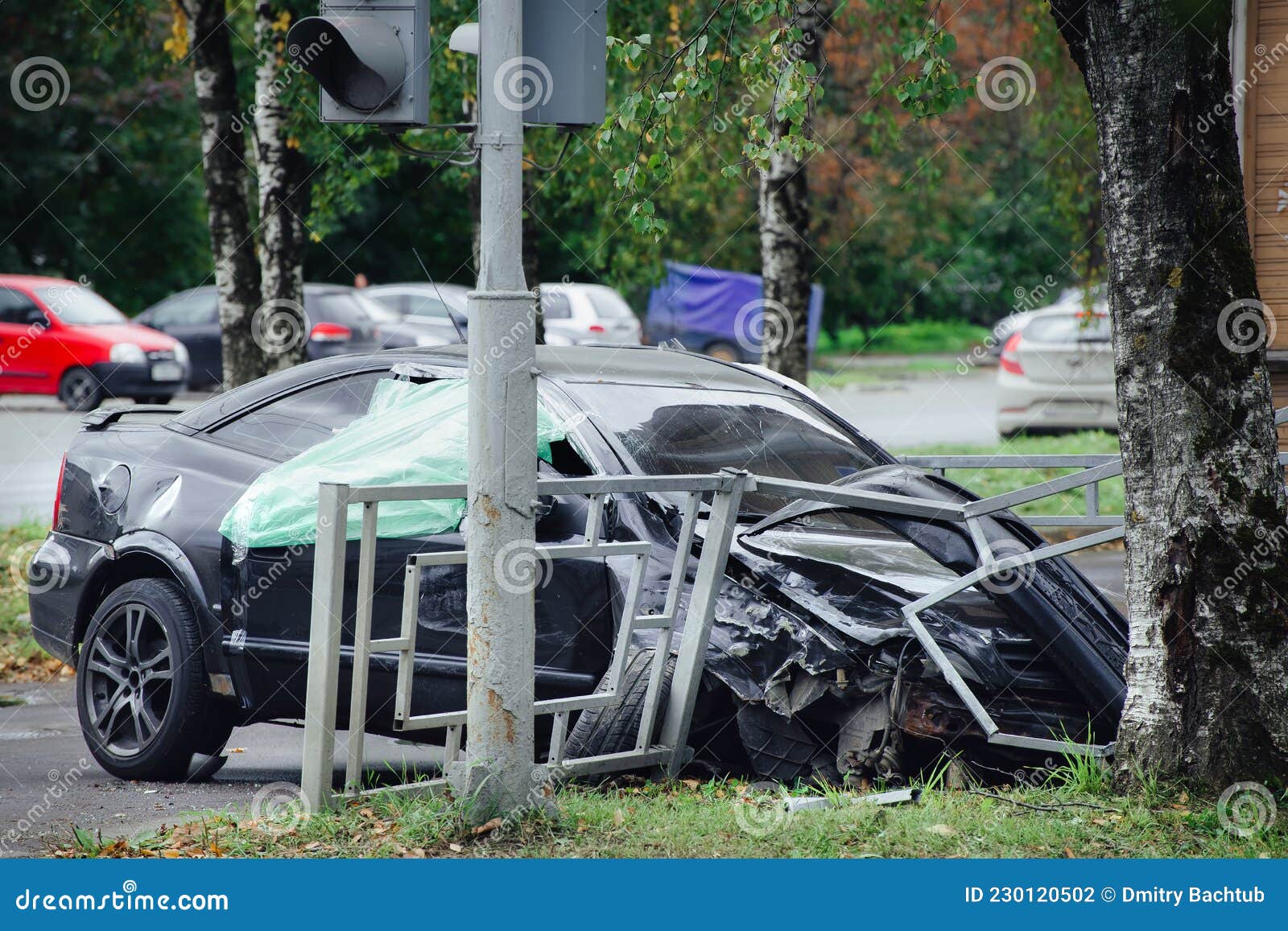 Car Crashed into a Road Fence Next To a Tree Stock Photo - Image of ...