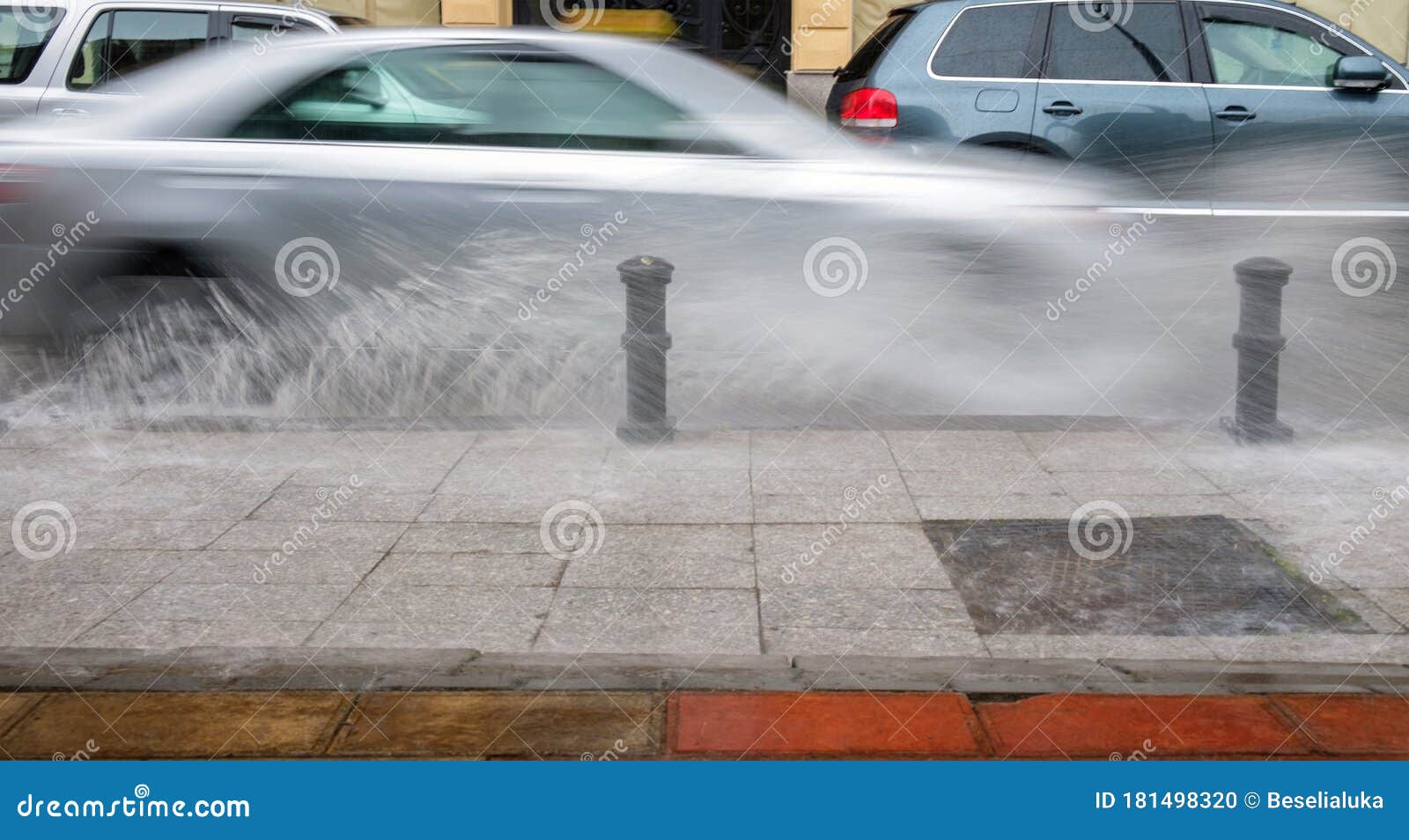 Car Crossing a Puddle and Splashing Water Stock Photo - Image of ...
