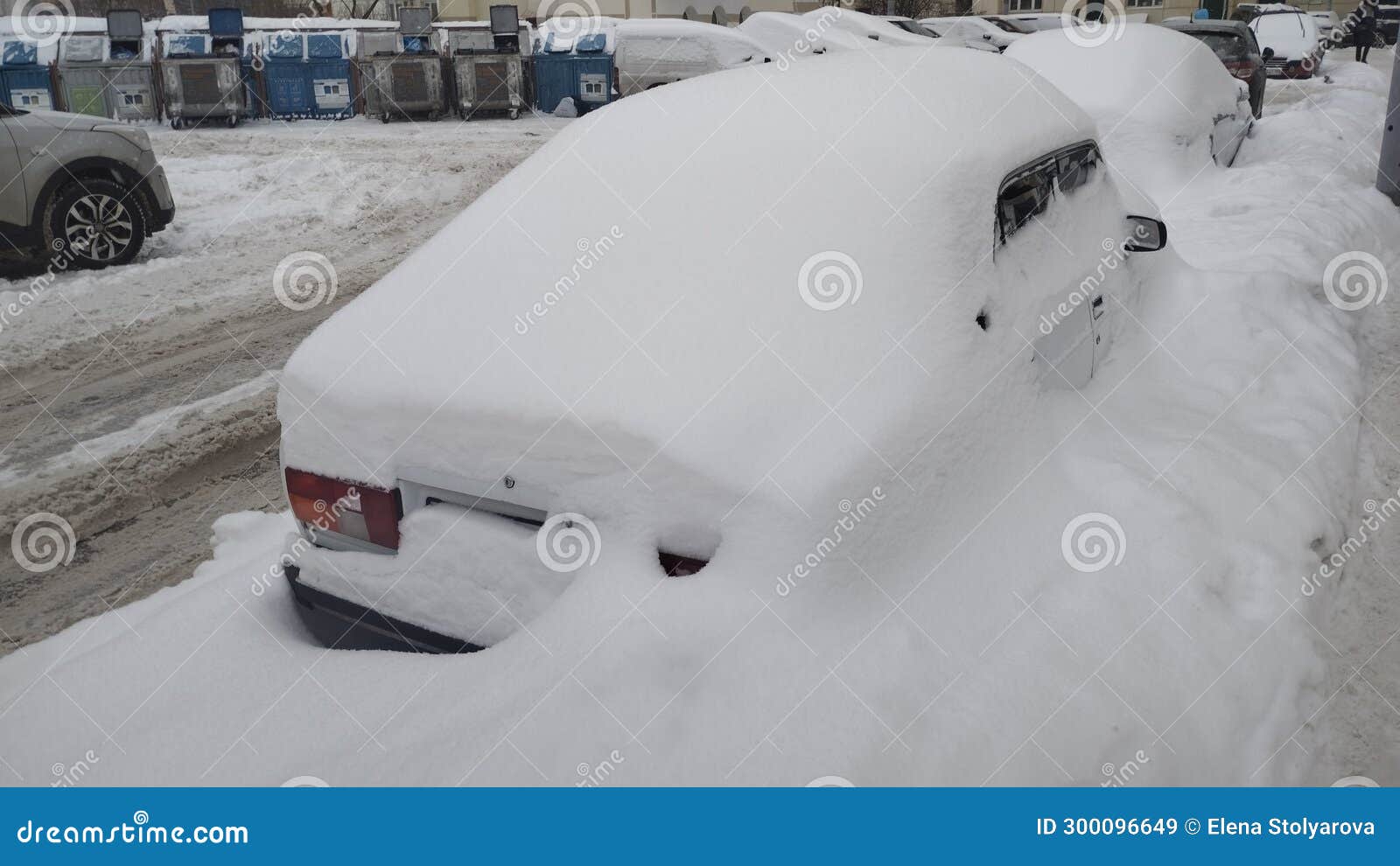 The Car at the Curb is Covered with a Large Layer of Snow, Stuck in a ...