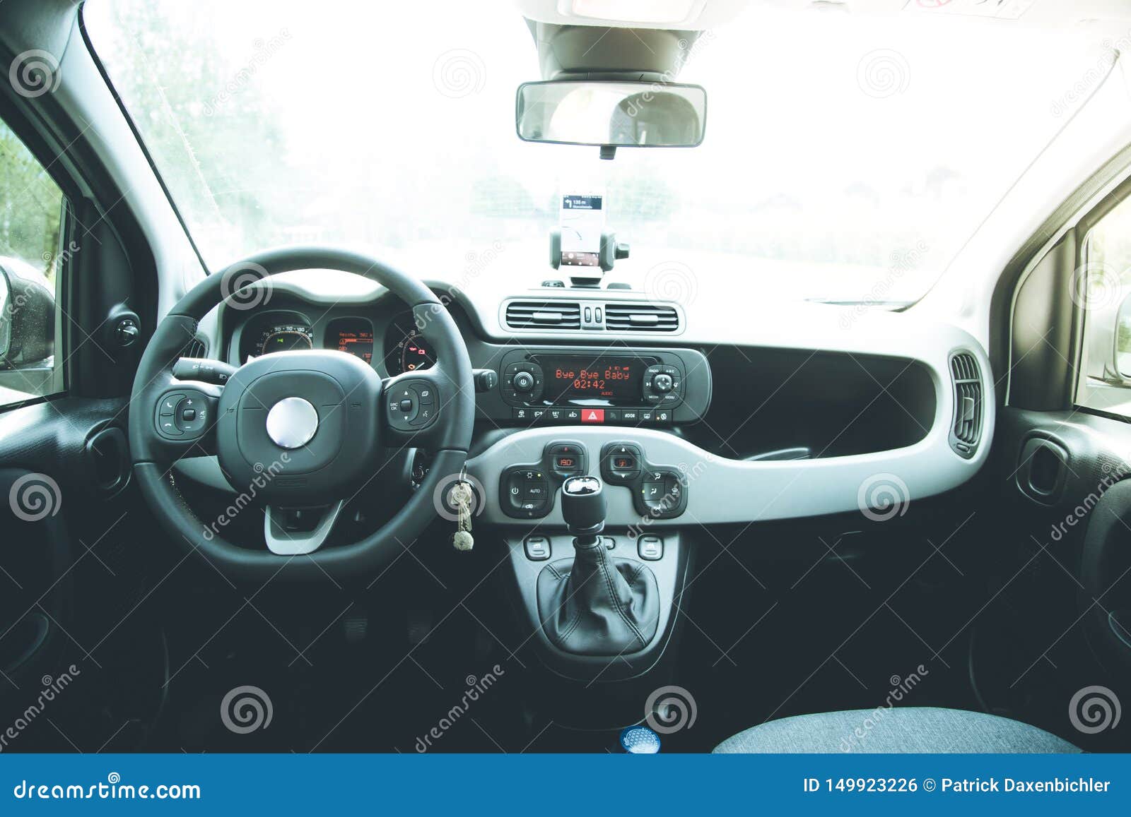 Car Dashboard with Smartphone Used As Navigation Device, Bright and ...