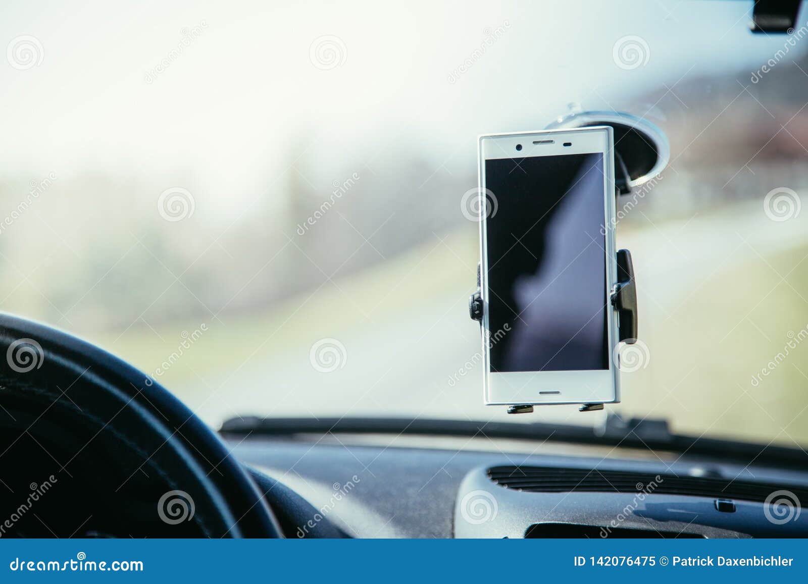 Car Dashboard with Smartphone Used As Navigation Device, Bright and ...
