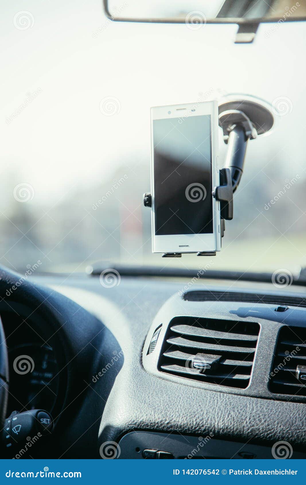 Car Dashboard with Smartphone Used As Navigation Device, Bright and ...