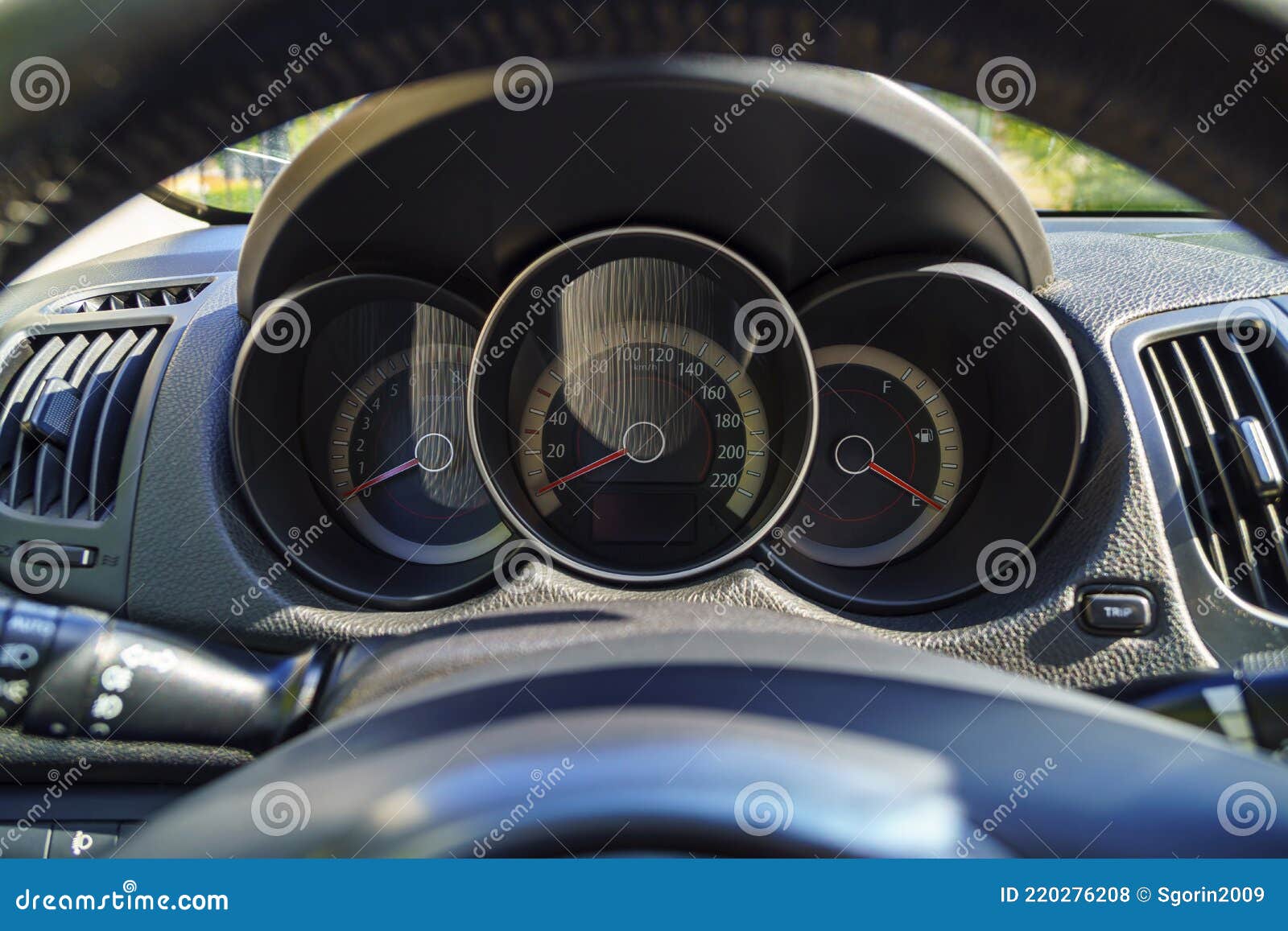 Car Dashboard through the Steering Wheel Frame Stock Photo - Image of ...