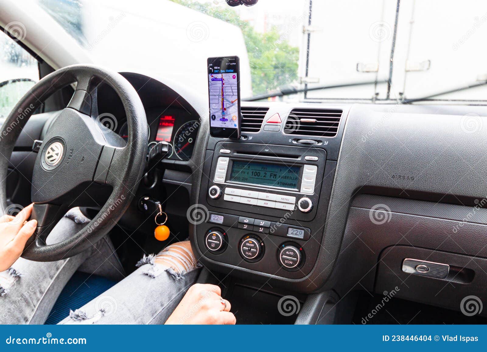 In Car Dashboard View with Smartphone on Waze Maps. Driver Using Waze ...
