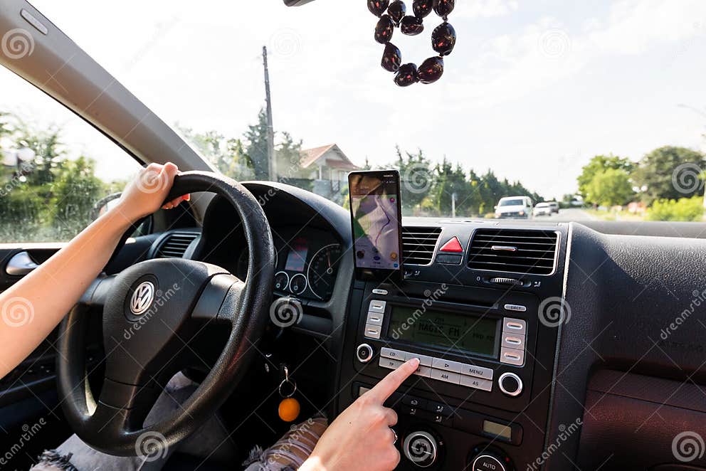 In Car Dashboard View with Smartphone on Waze Maps. Driver Using Waze ...