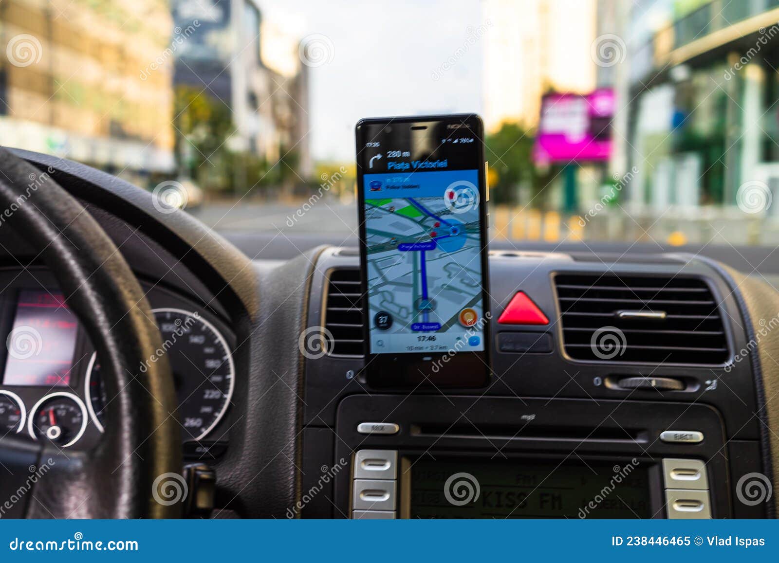 In Car Dashboard View with Smartphone on Waze Maps. Driver Using Waze ...
