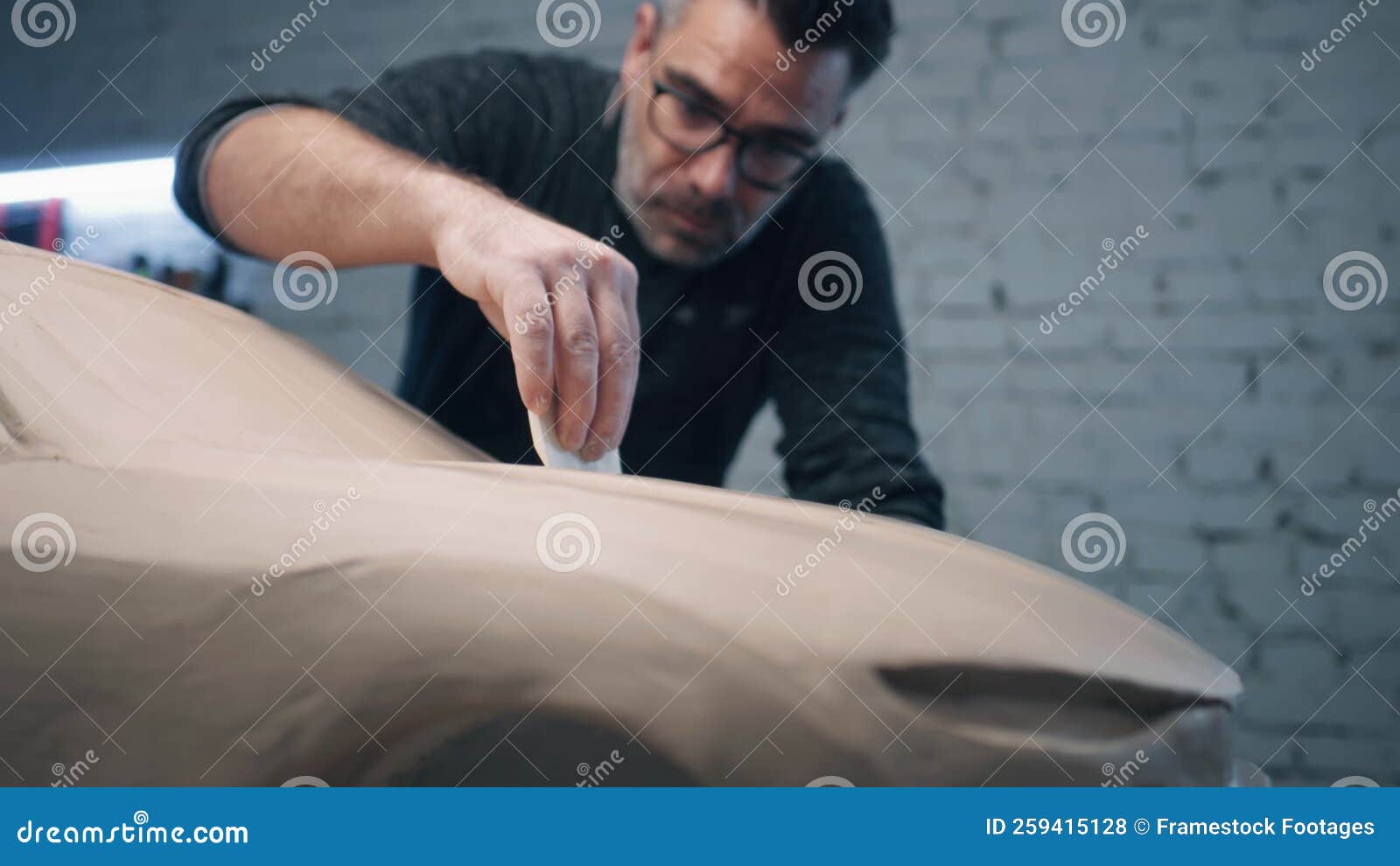Car Designer Works on the Design Details of Sculpture of Car with ...