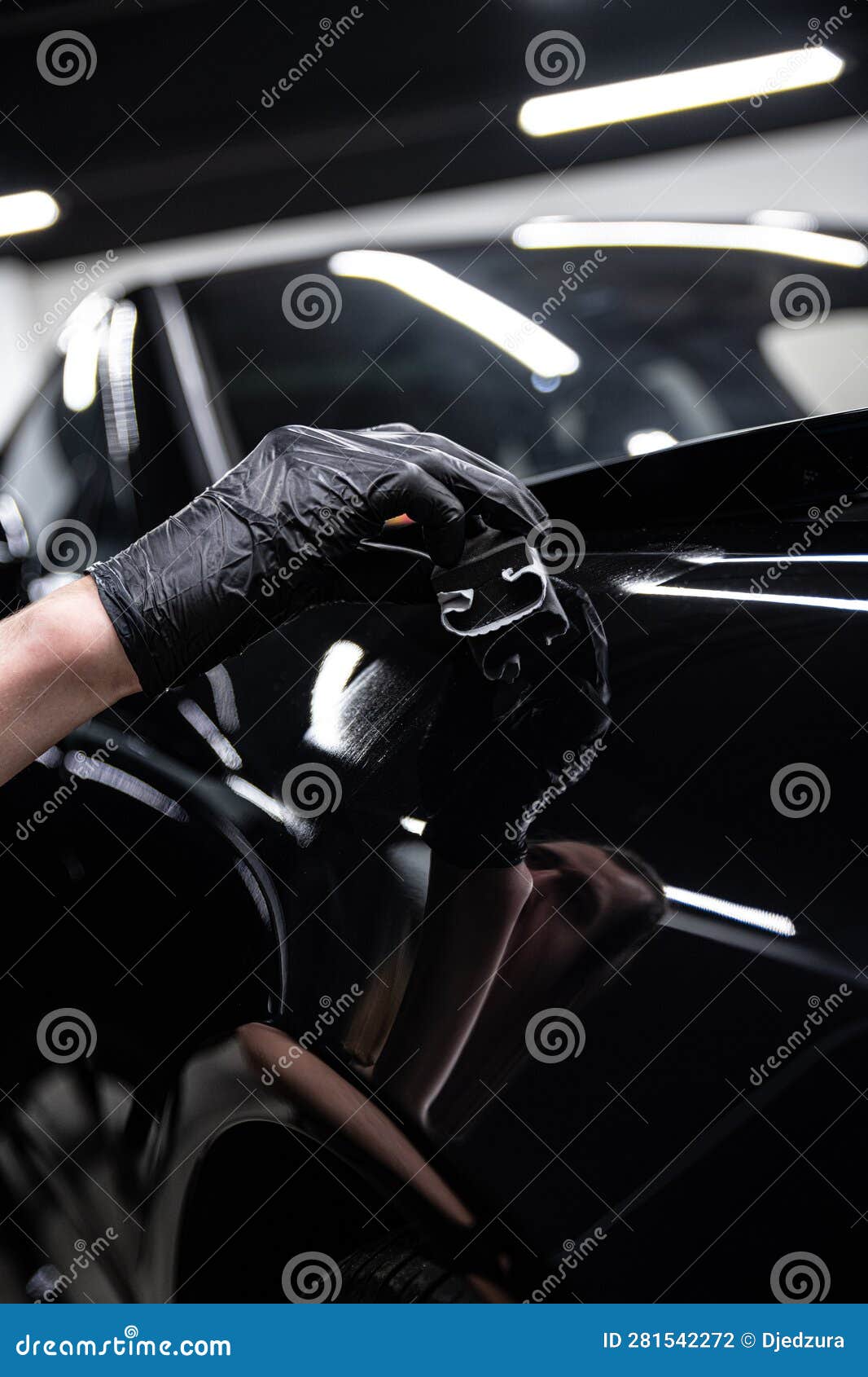 Car Detailing Studio Worker Applies a Ceramic Coating Stock Photo ...