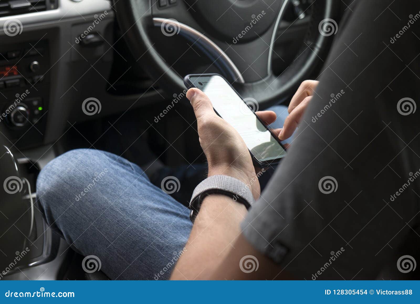 Car driver distraction stock photo. Image of mobile - 128305454