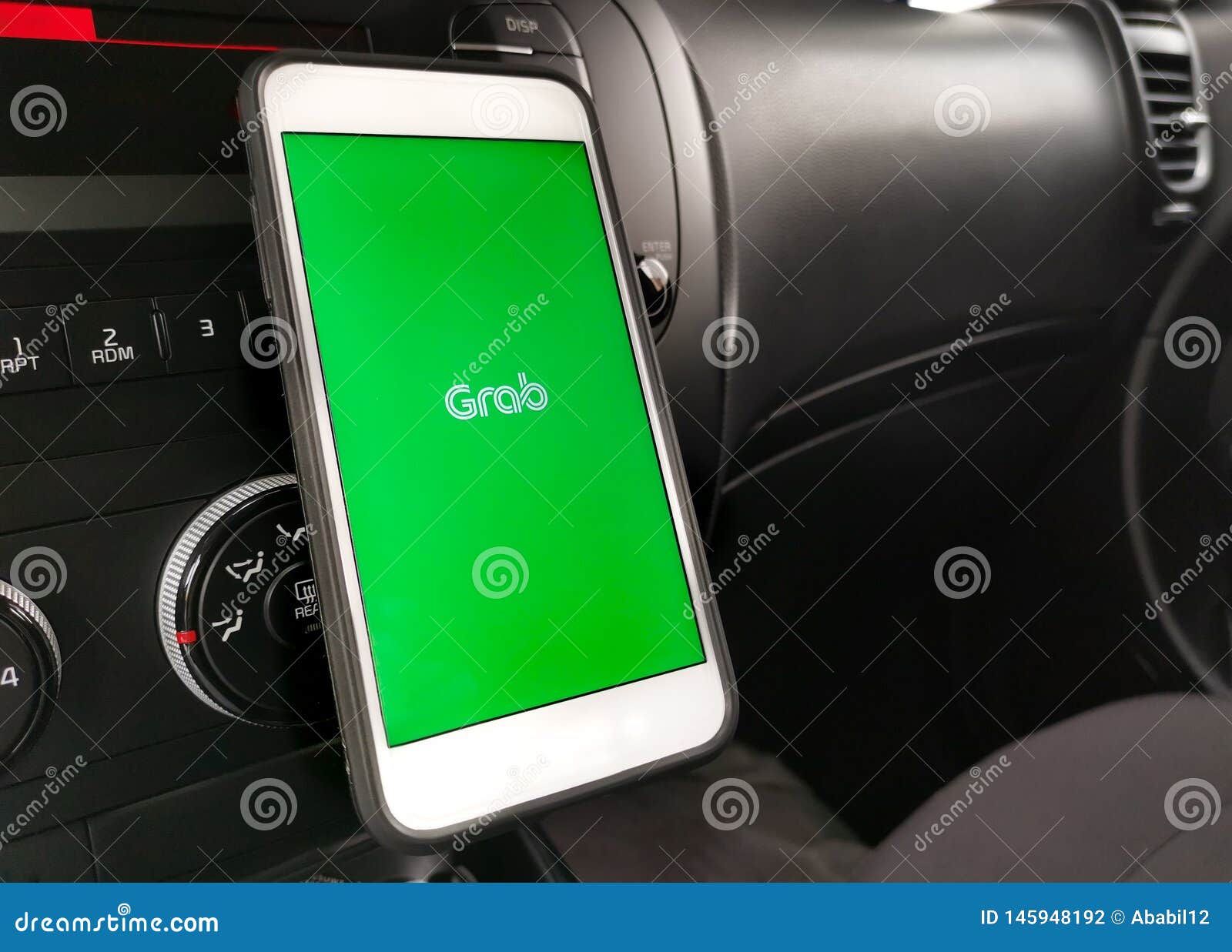 Car Driver Using Smartphone with with Grab App on Dashboard. Editorial ...
